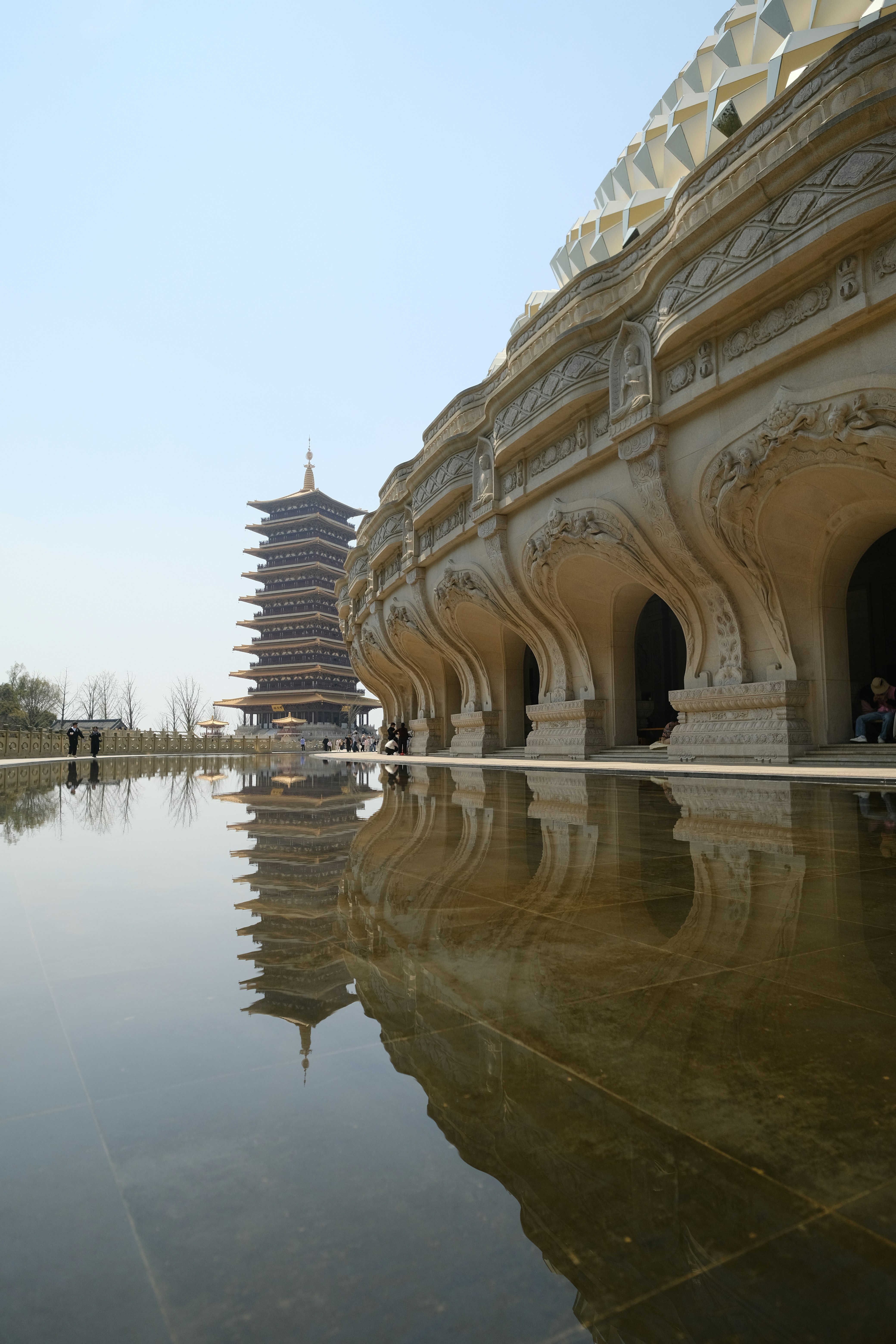Stone Courtyard Echoes: A Reflection of Pagodas and Pillars