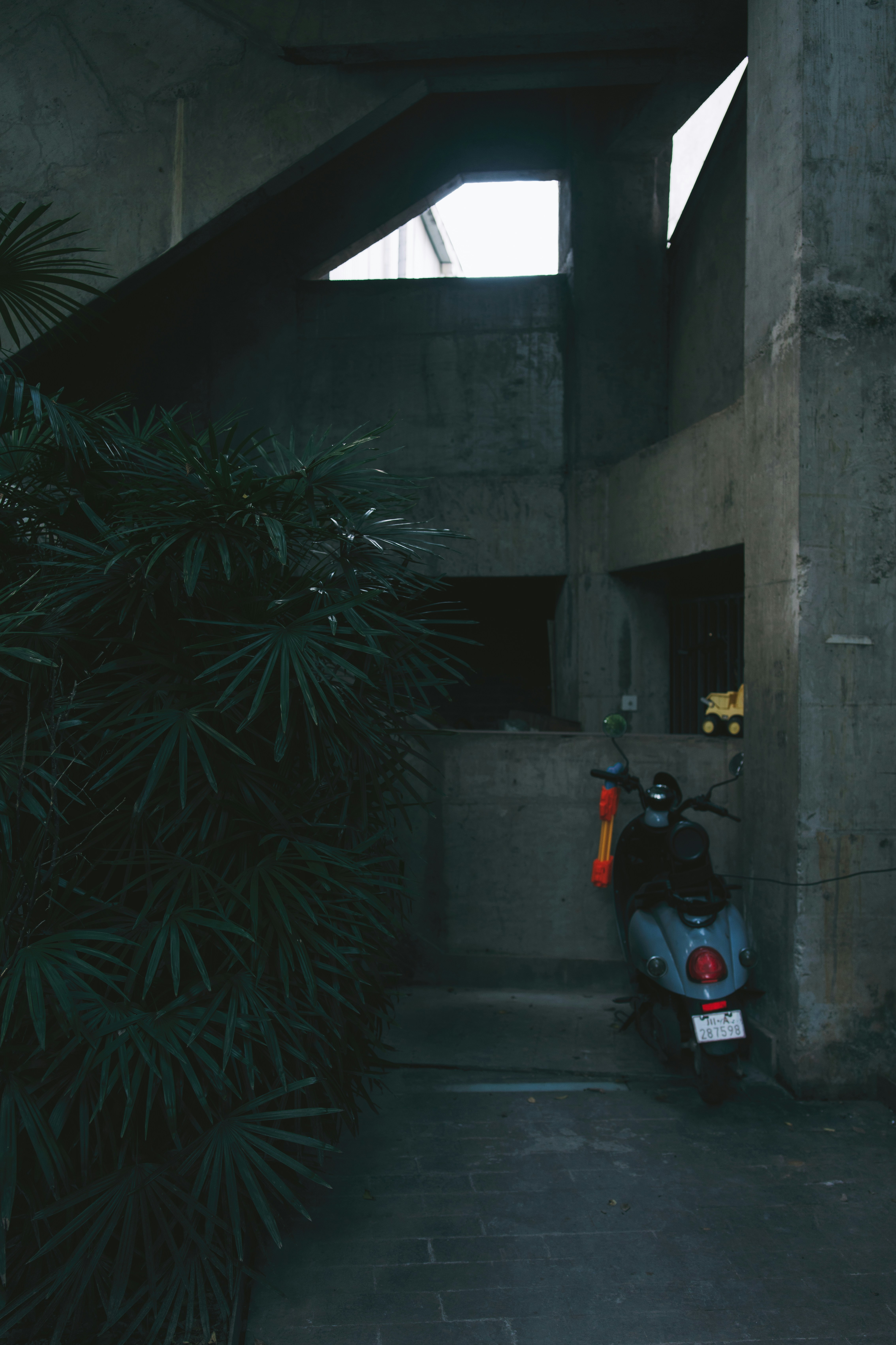 Concrete Atrium Gateway with Scooter Peek