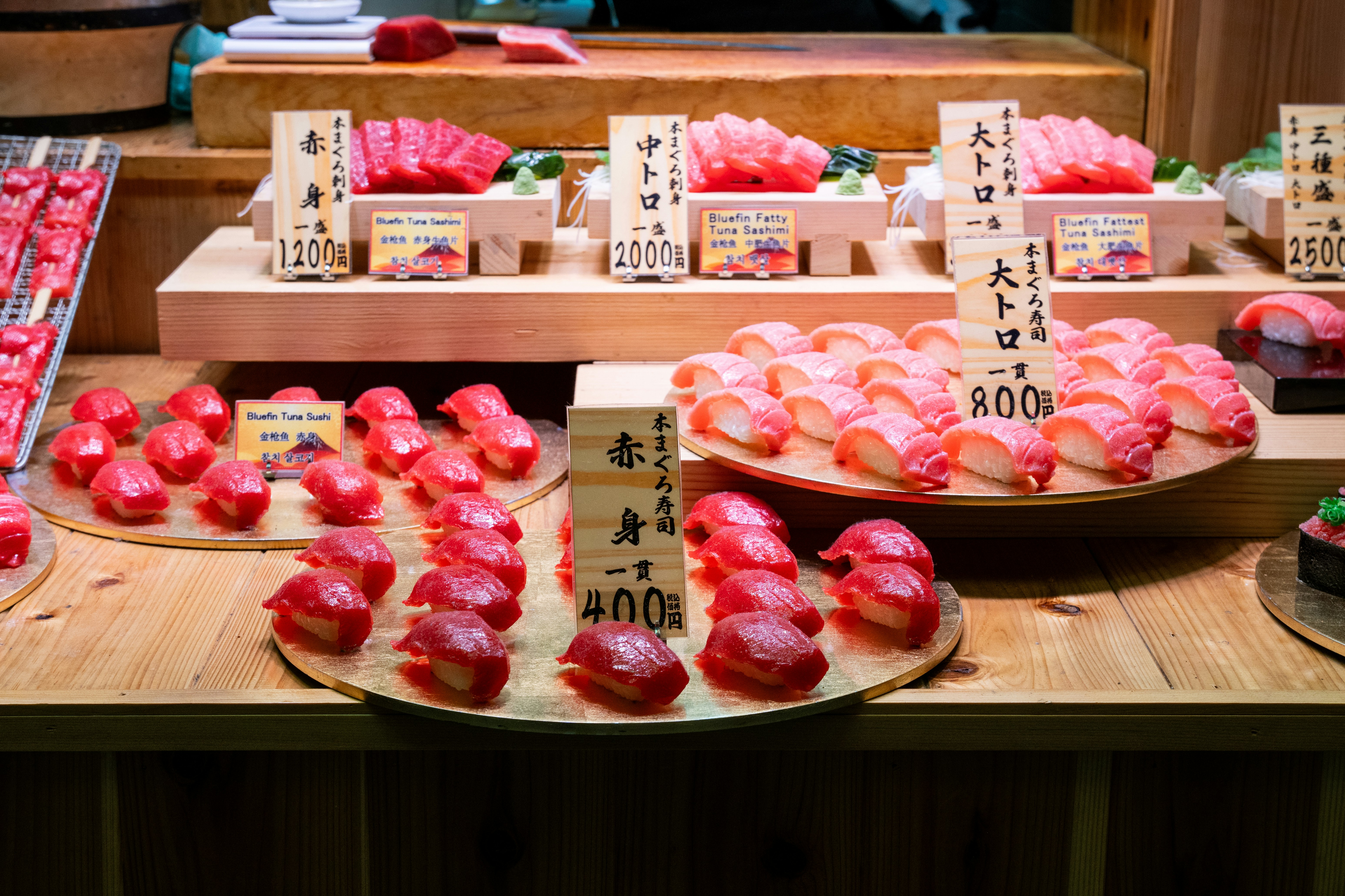 Pink-Crowned Nigiri Parade at a Japanese Sushi Counter