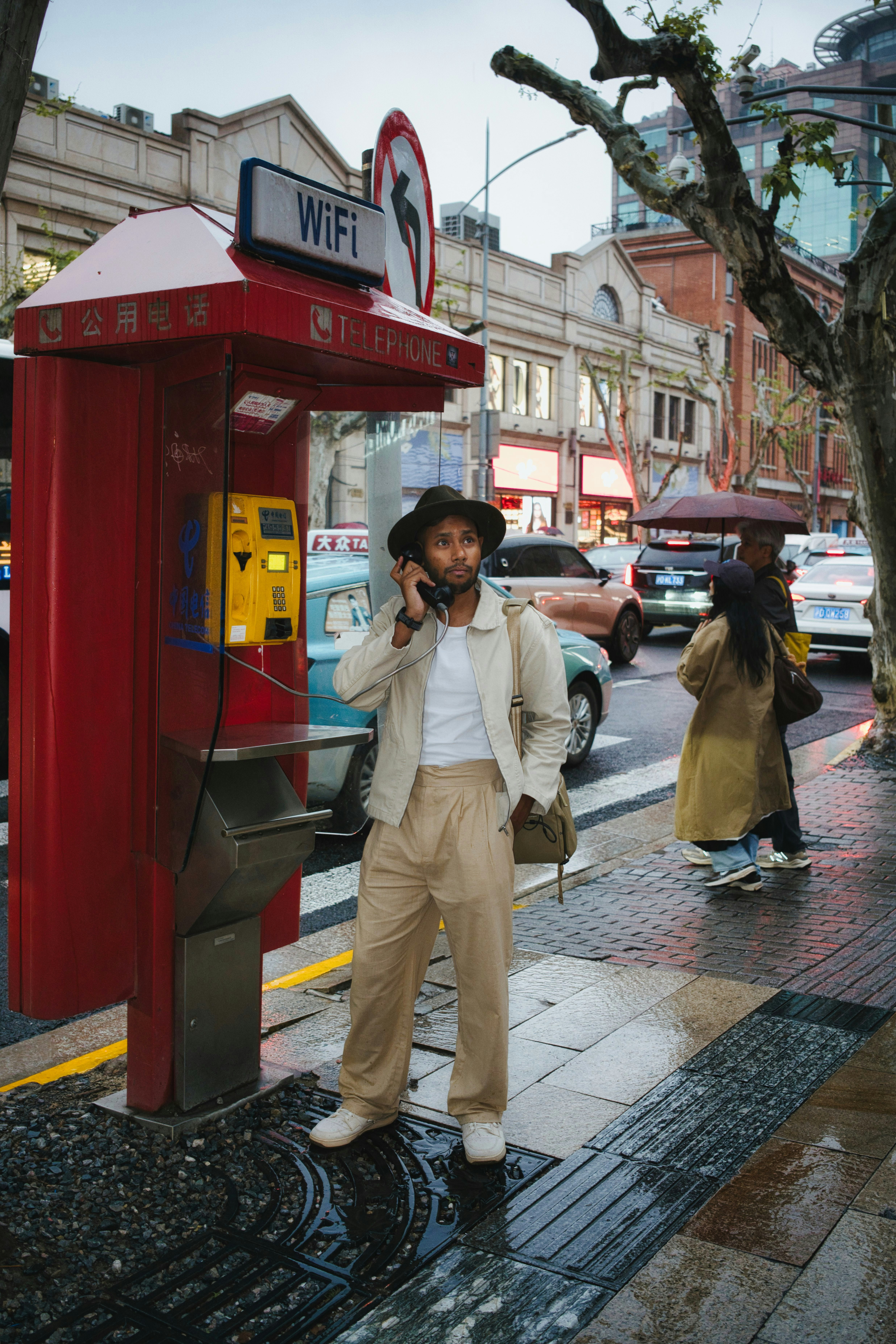 City Street Portrait: The Messenger in a Rain-Washed Avenue