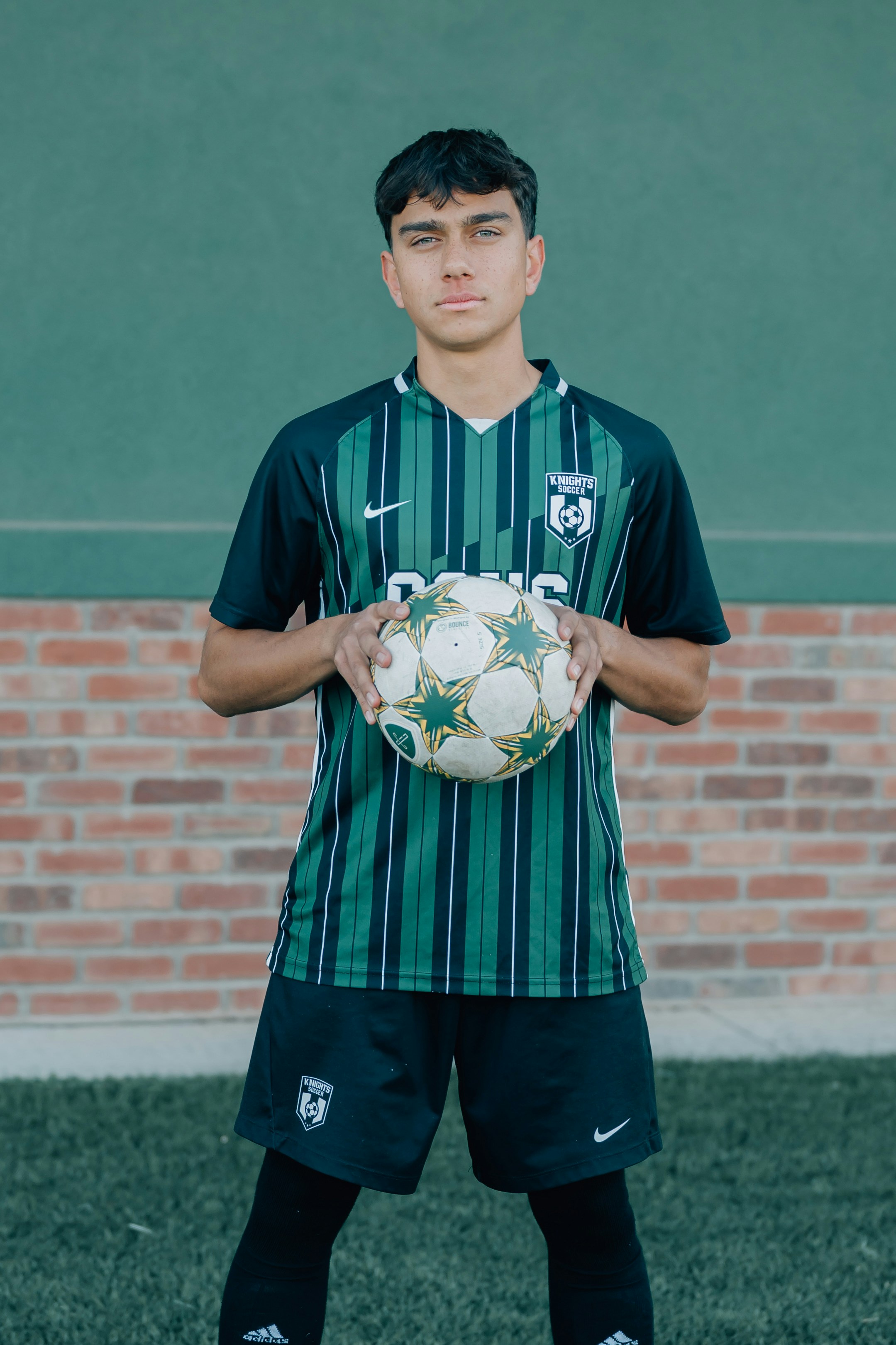 Youth Soccer Keeper Portrait with Striped Green Jersey