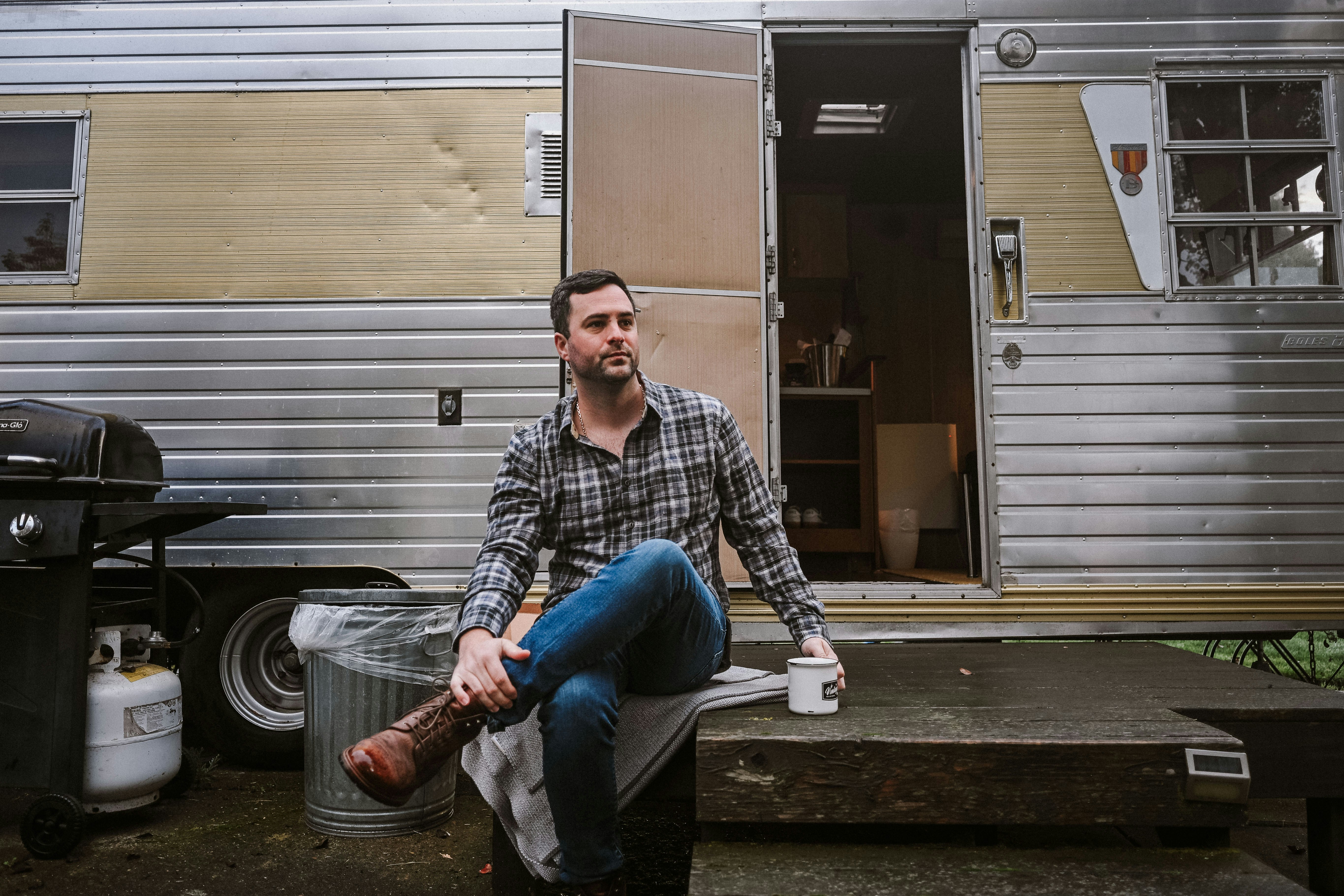 Front Porch Solitude: A Man Reflects at the Trailer Doorstep