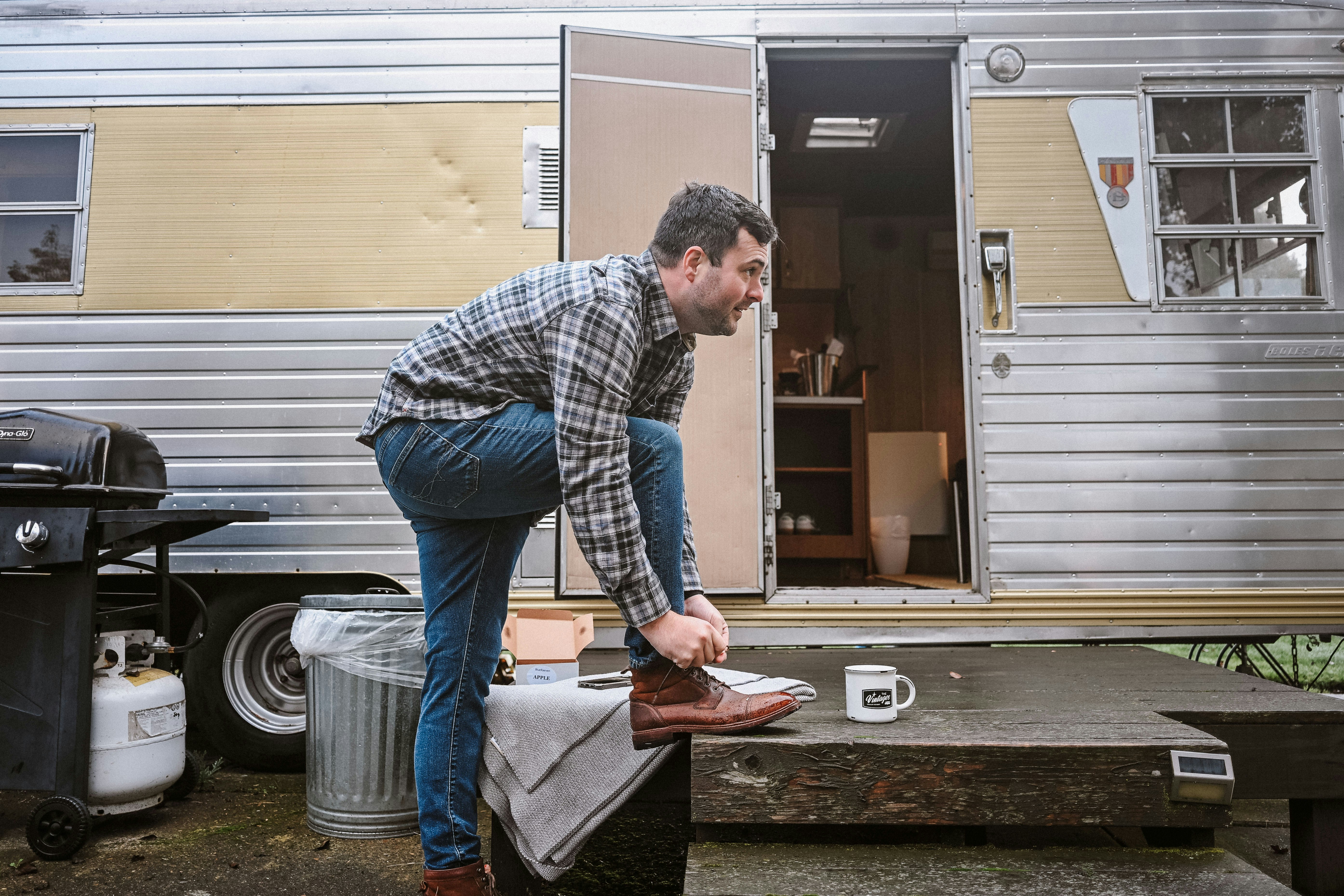 Staged Transfer: The Man Boots Up a Moment by the Trailer