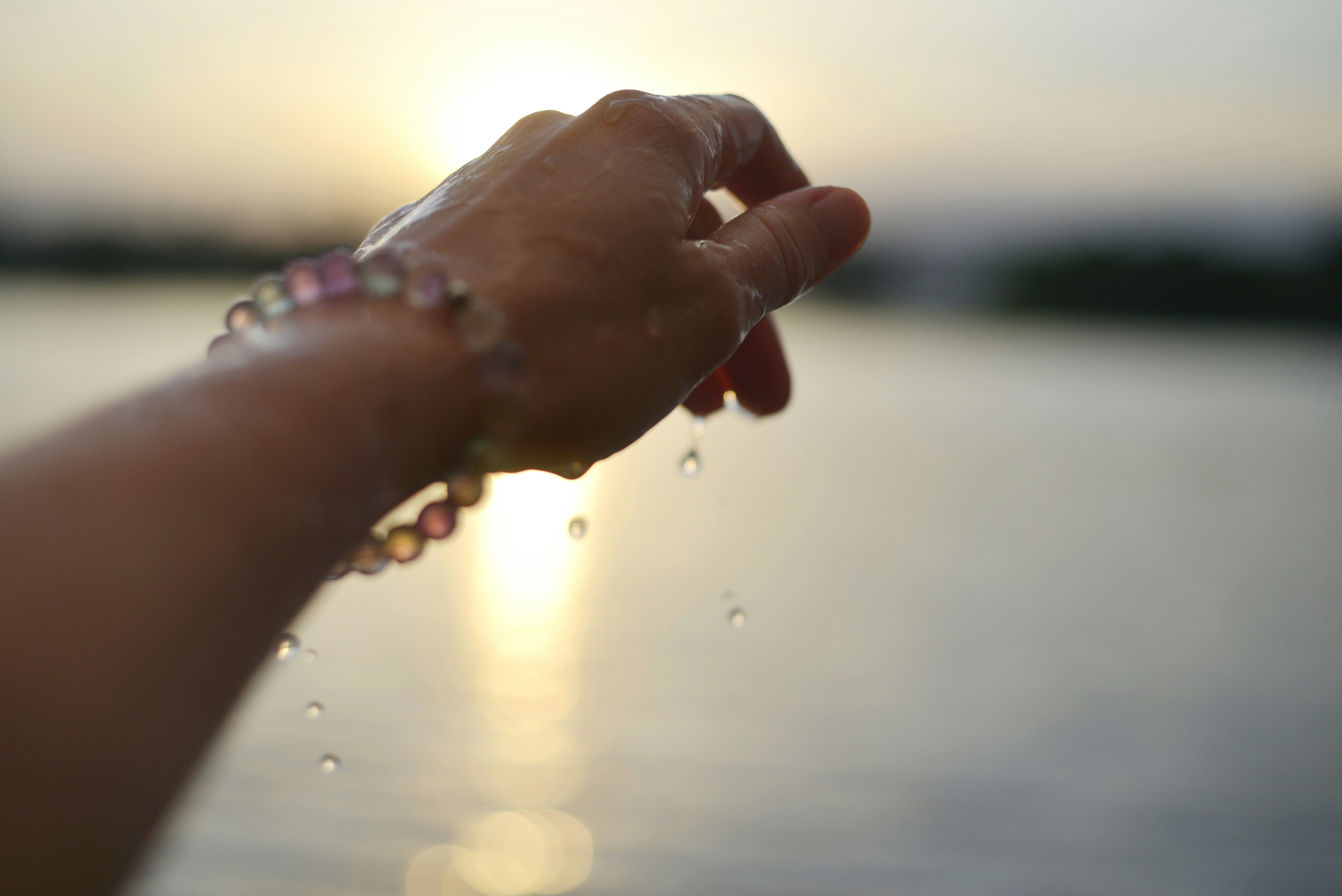 Graceful Arc: A Day’s Final Reach over Water