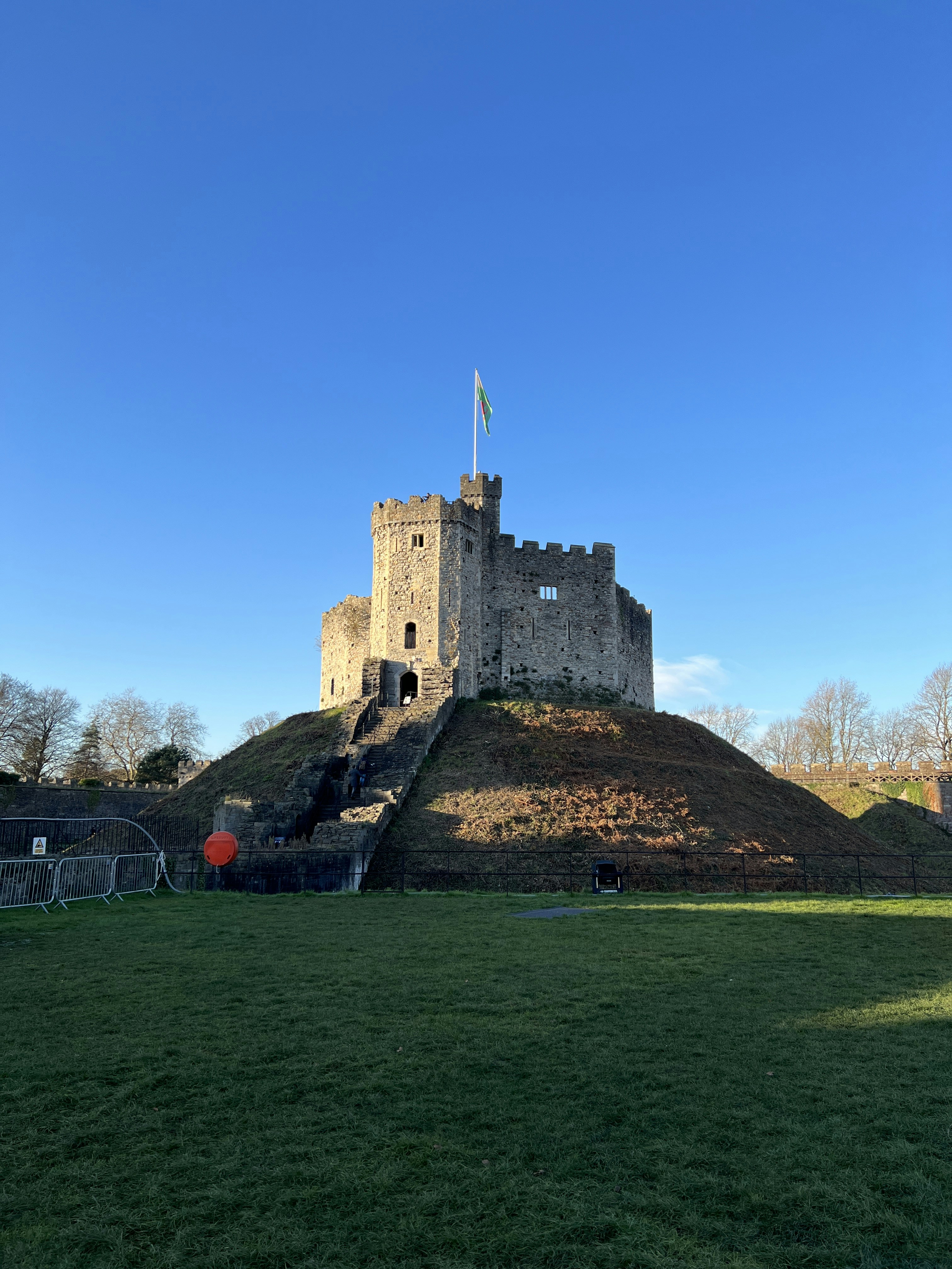 Castle on a Green Hill under a Clear Blue Sky