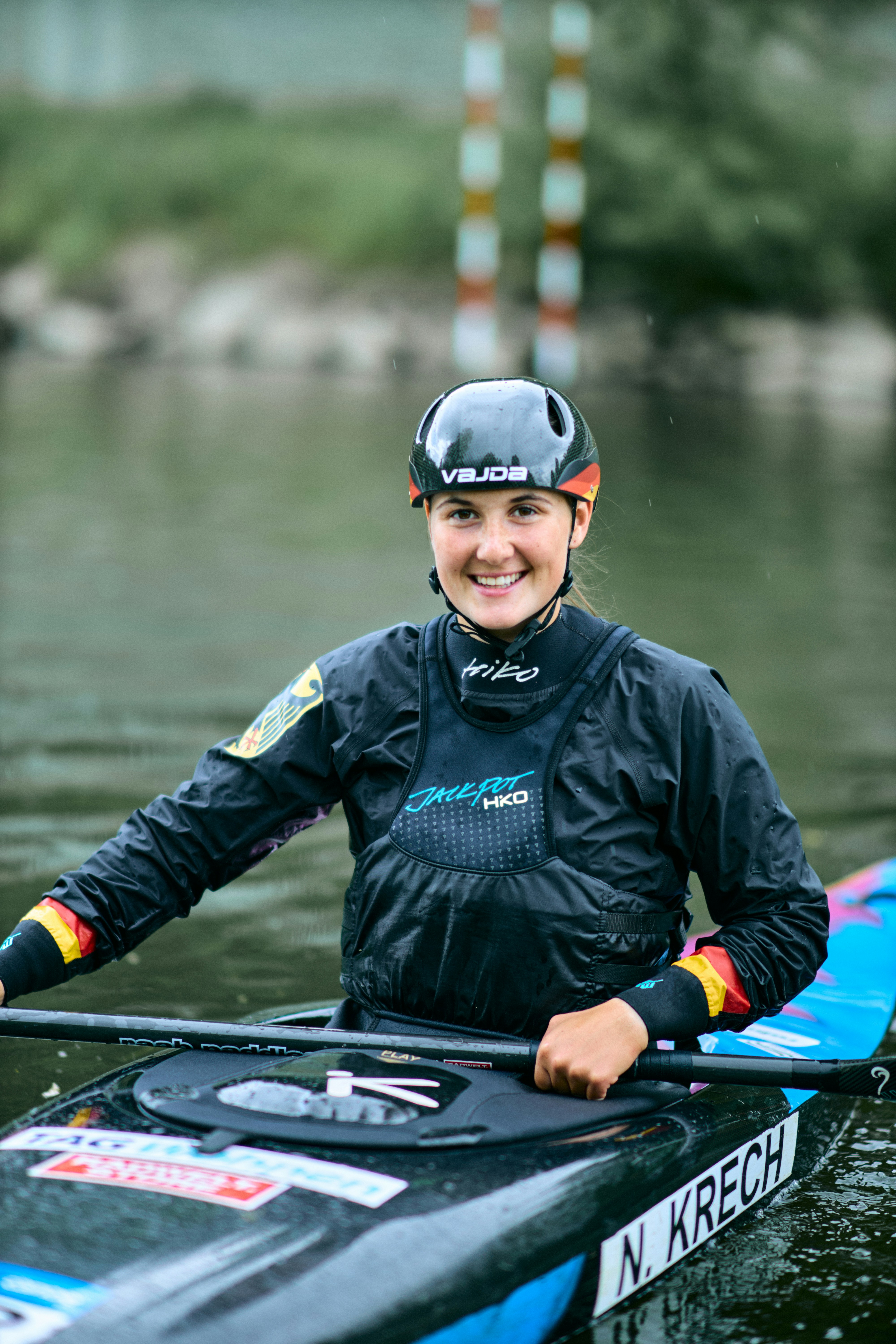 River Racer: Focused Smile in the Kayak Arena