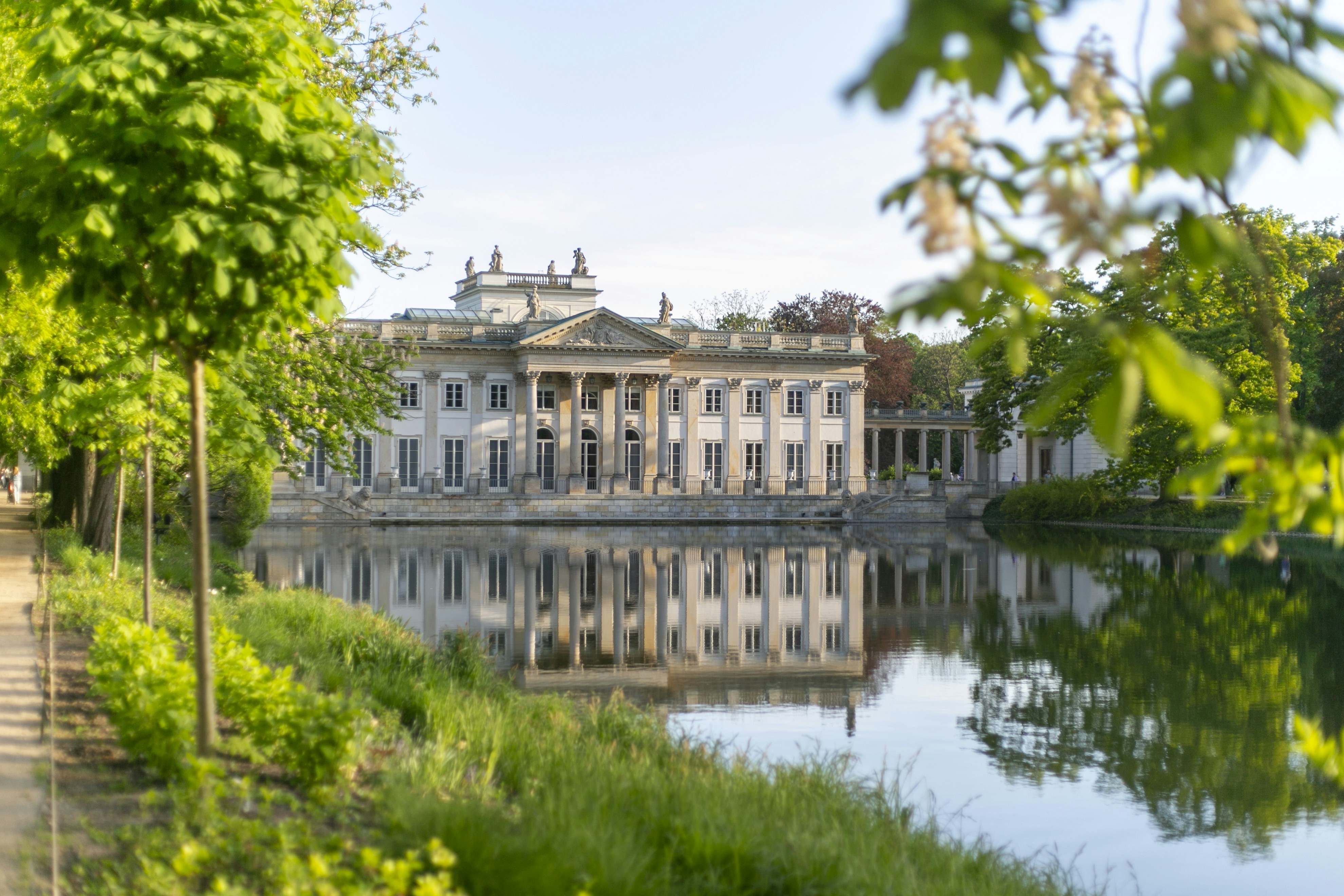 European Manor by the Lake: Reflections and Green Corridor