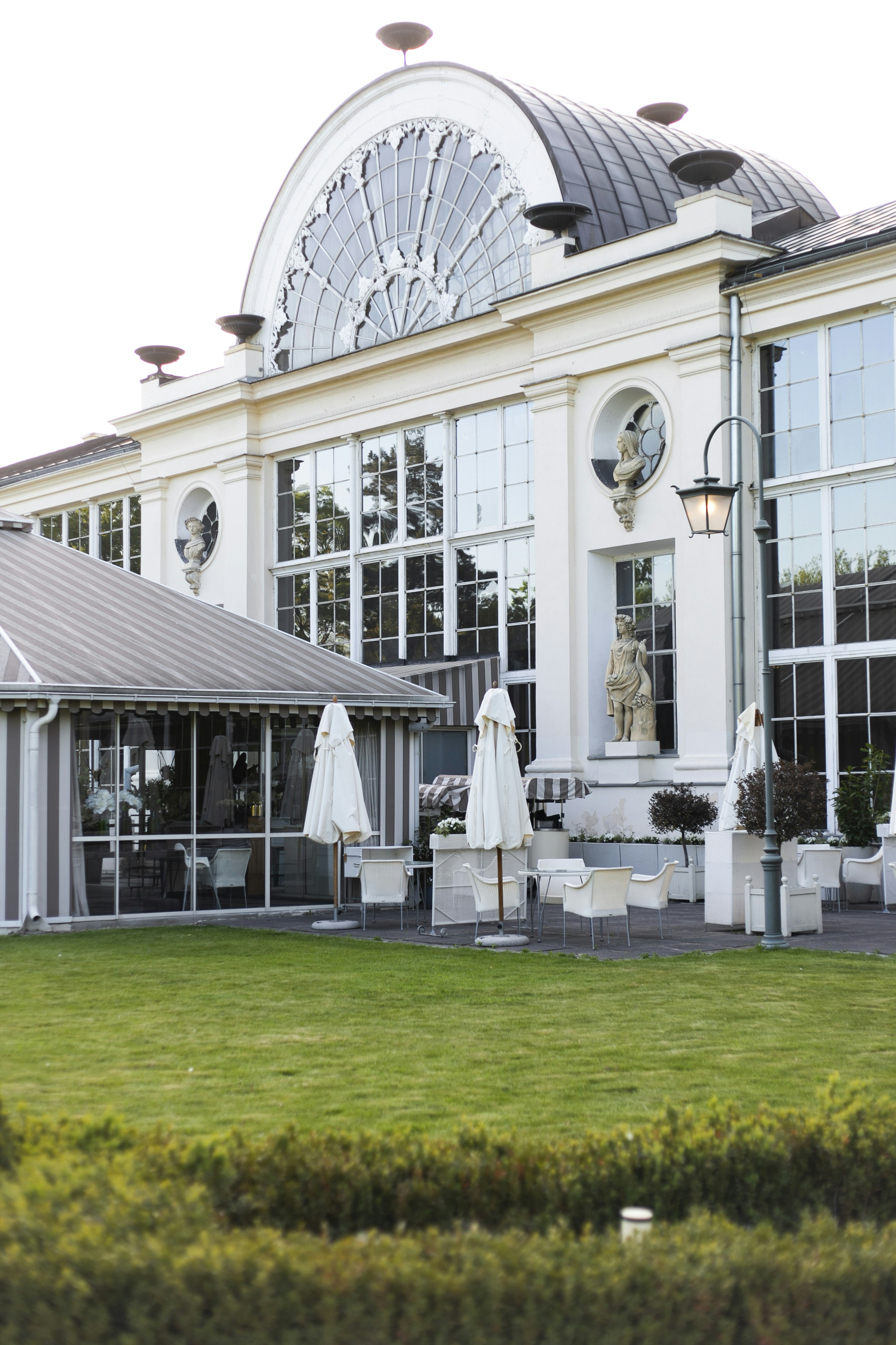 Sunlit Conservatory Facade: Symmetry and Glass
