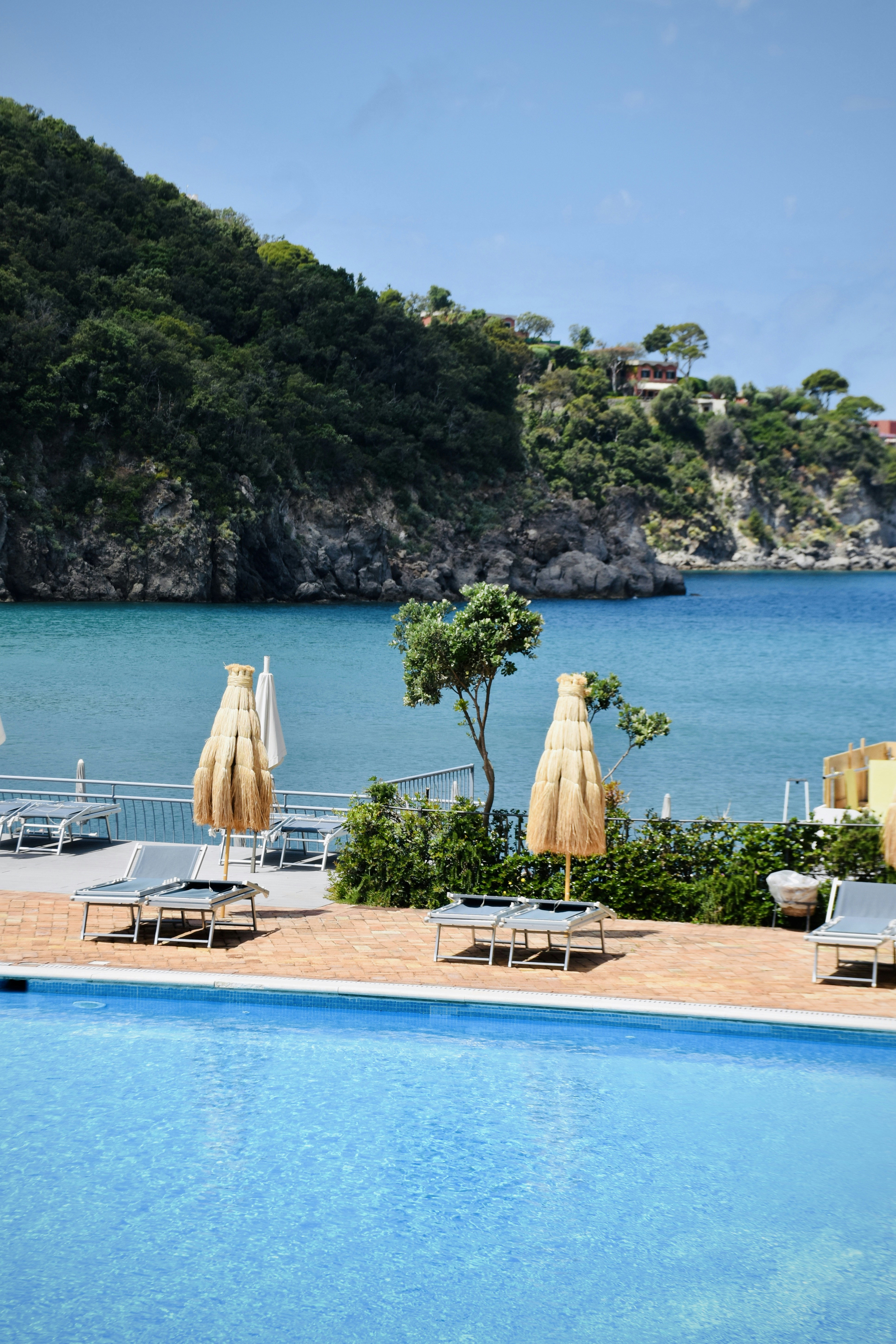 Infinity of blue: poolside retreat overlooking a cliffside cove