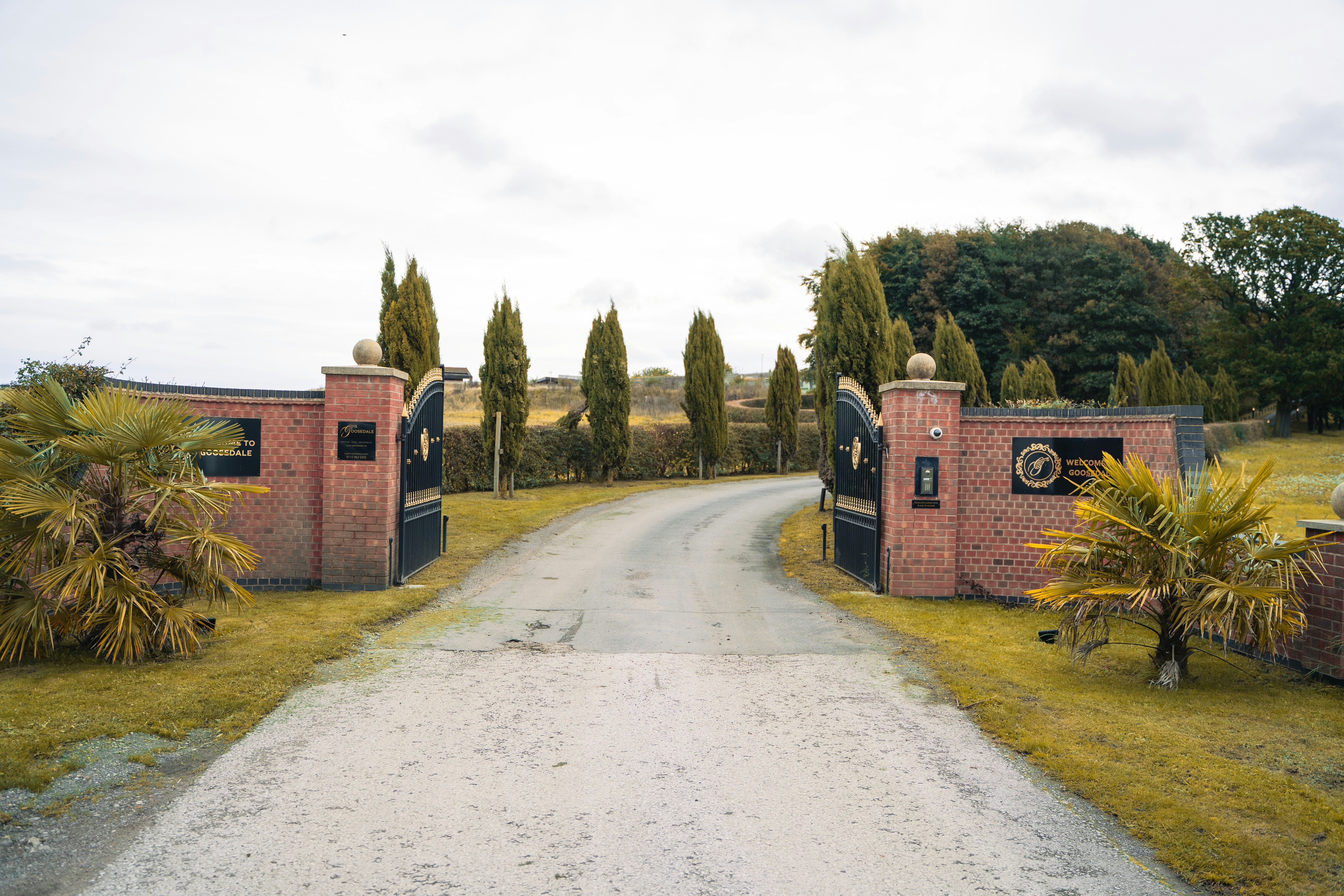 Driveway Gates Amid**a Formal Vista**