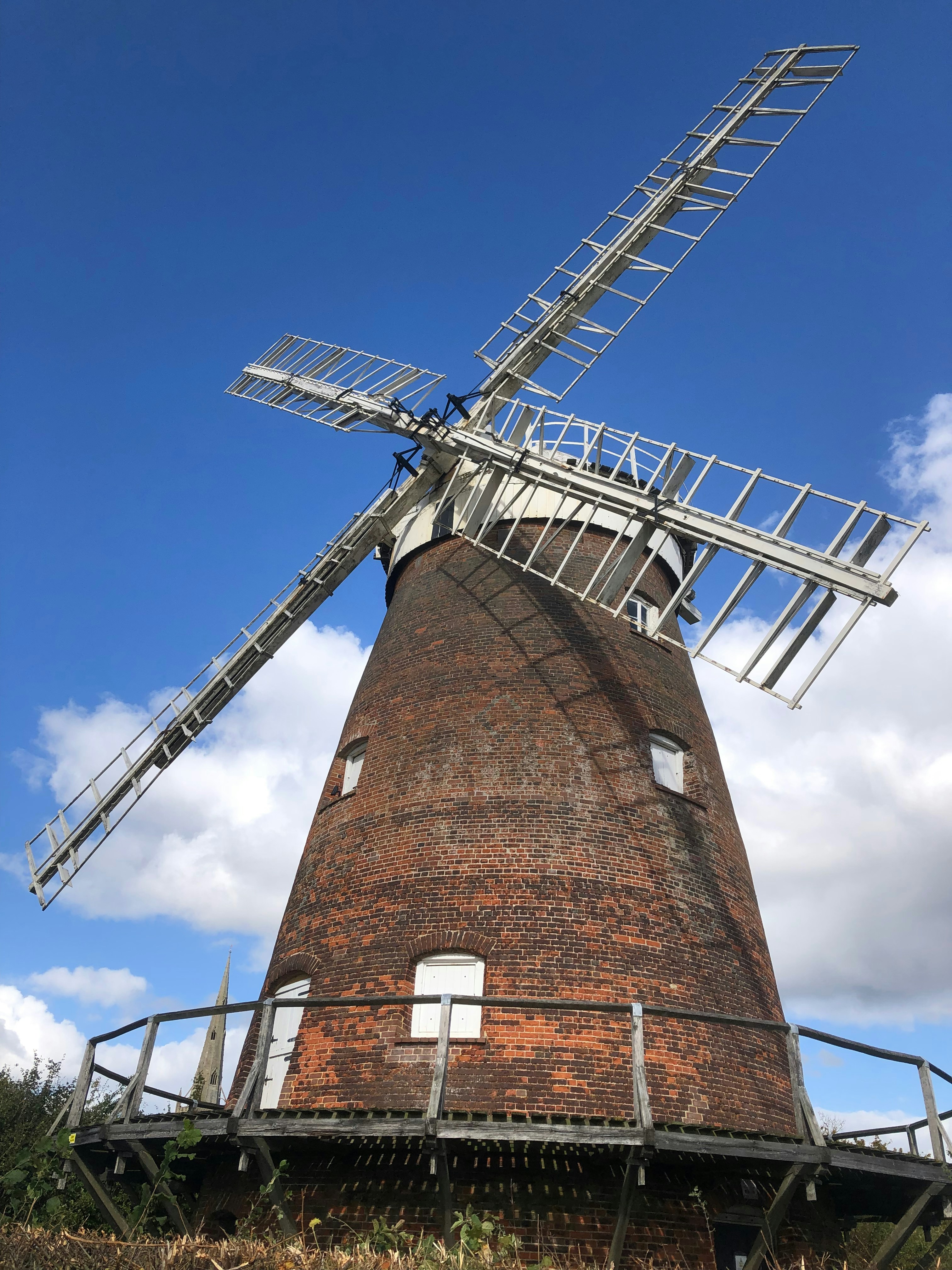 Standing Against the Sky: A Brick Windmill Reaches Toward the Sun