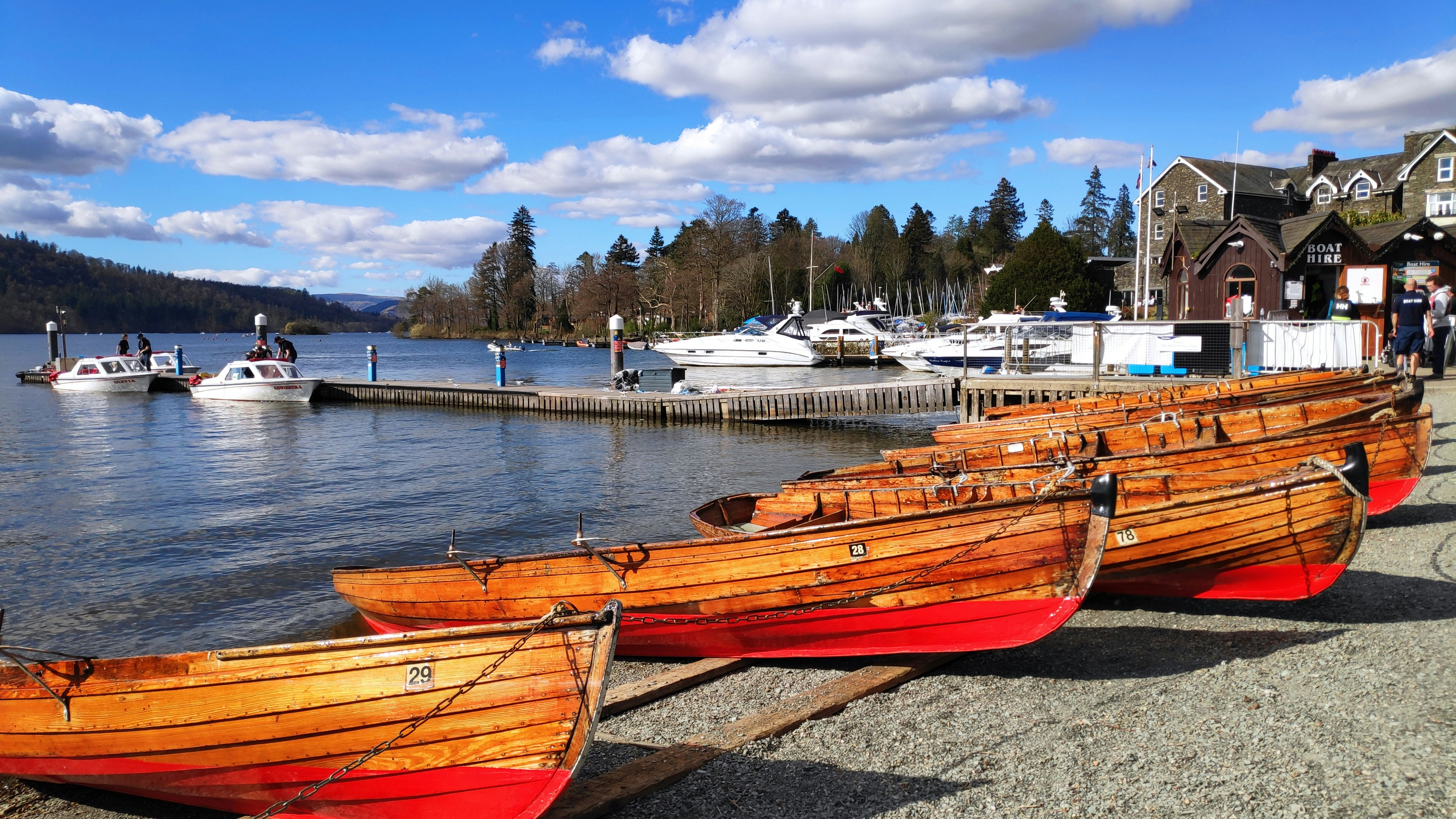 Rowing Boats on a Sunlit Lakefront