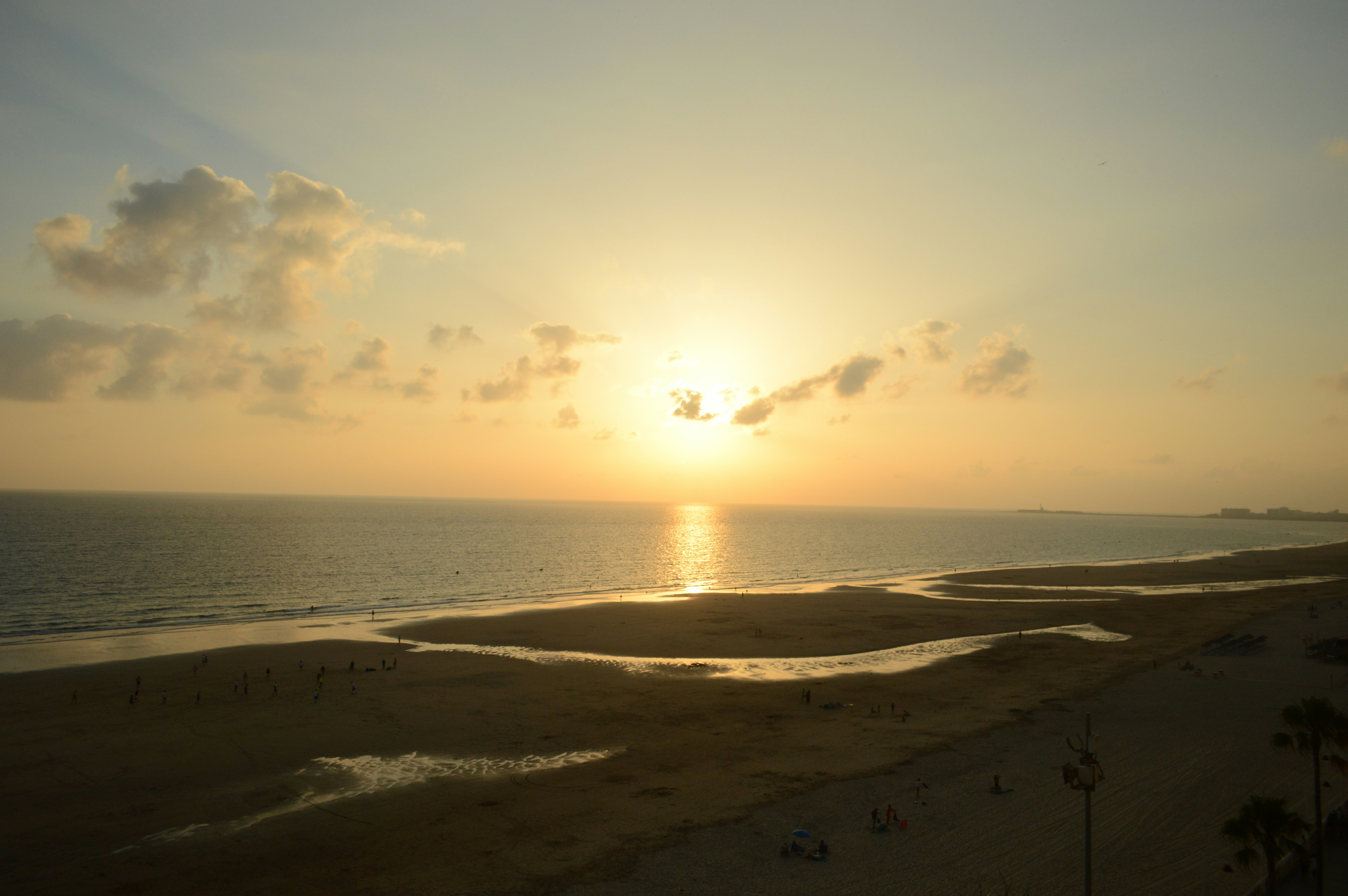 Sunset Over Tidal Mounds: Calm Horizon at Dusk