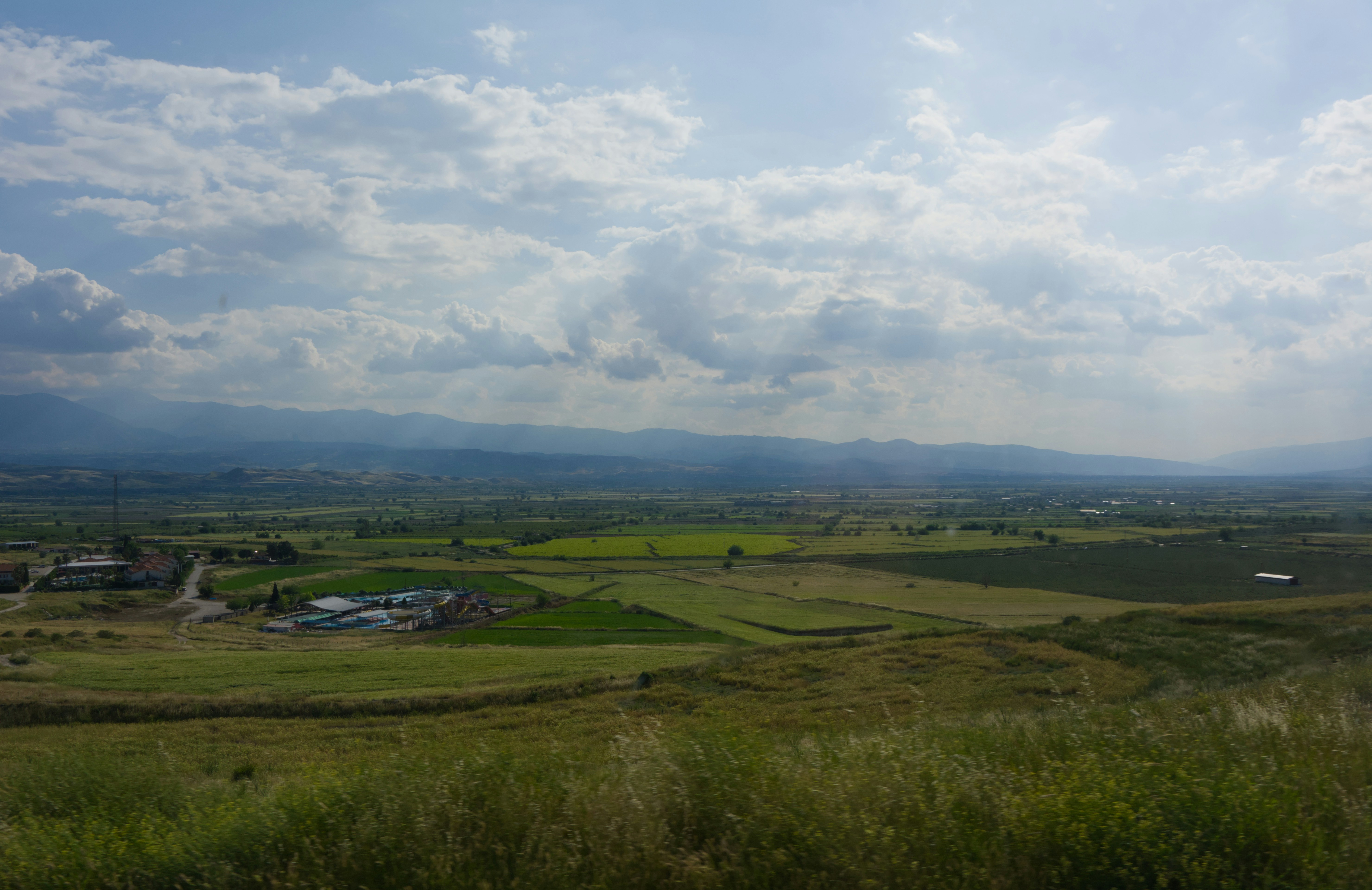 Expansive Farmland Under a Layered Sky