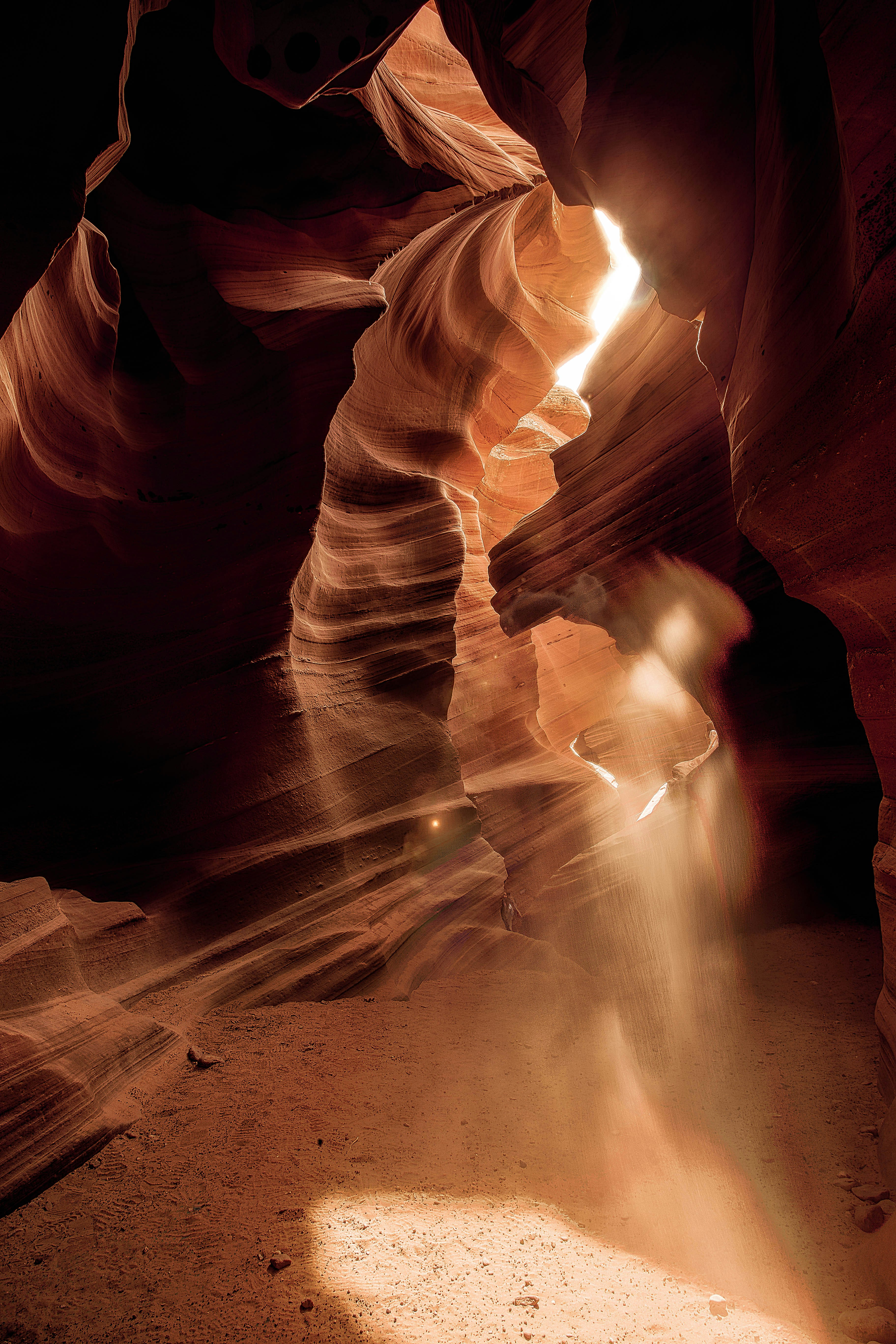 Sunbeams in a Canyon: Narrow Needles of Light Between Red Silence