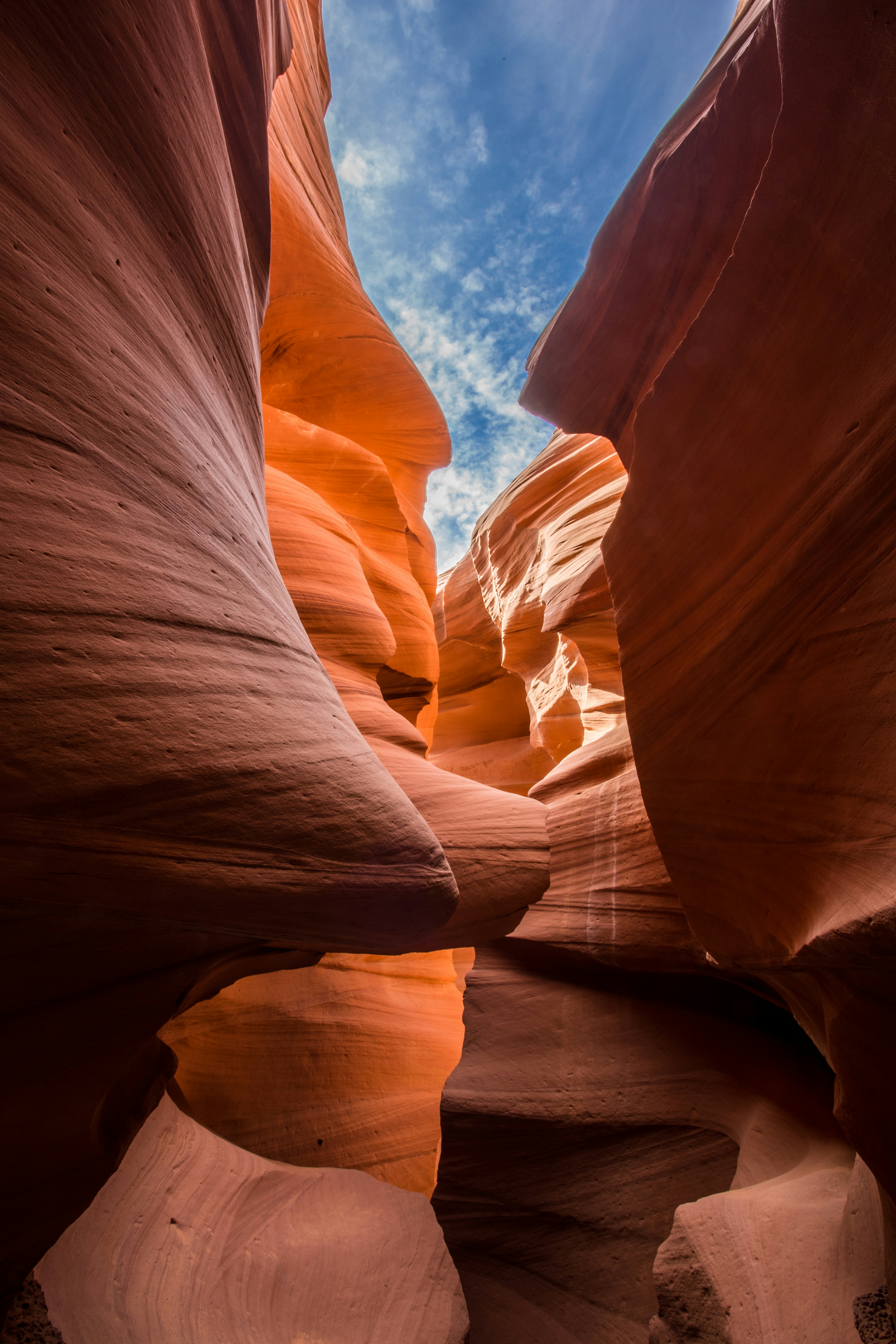 Sunlit Slot Canyon: Carved Orange Sandstone and Striated Walls