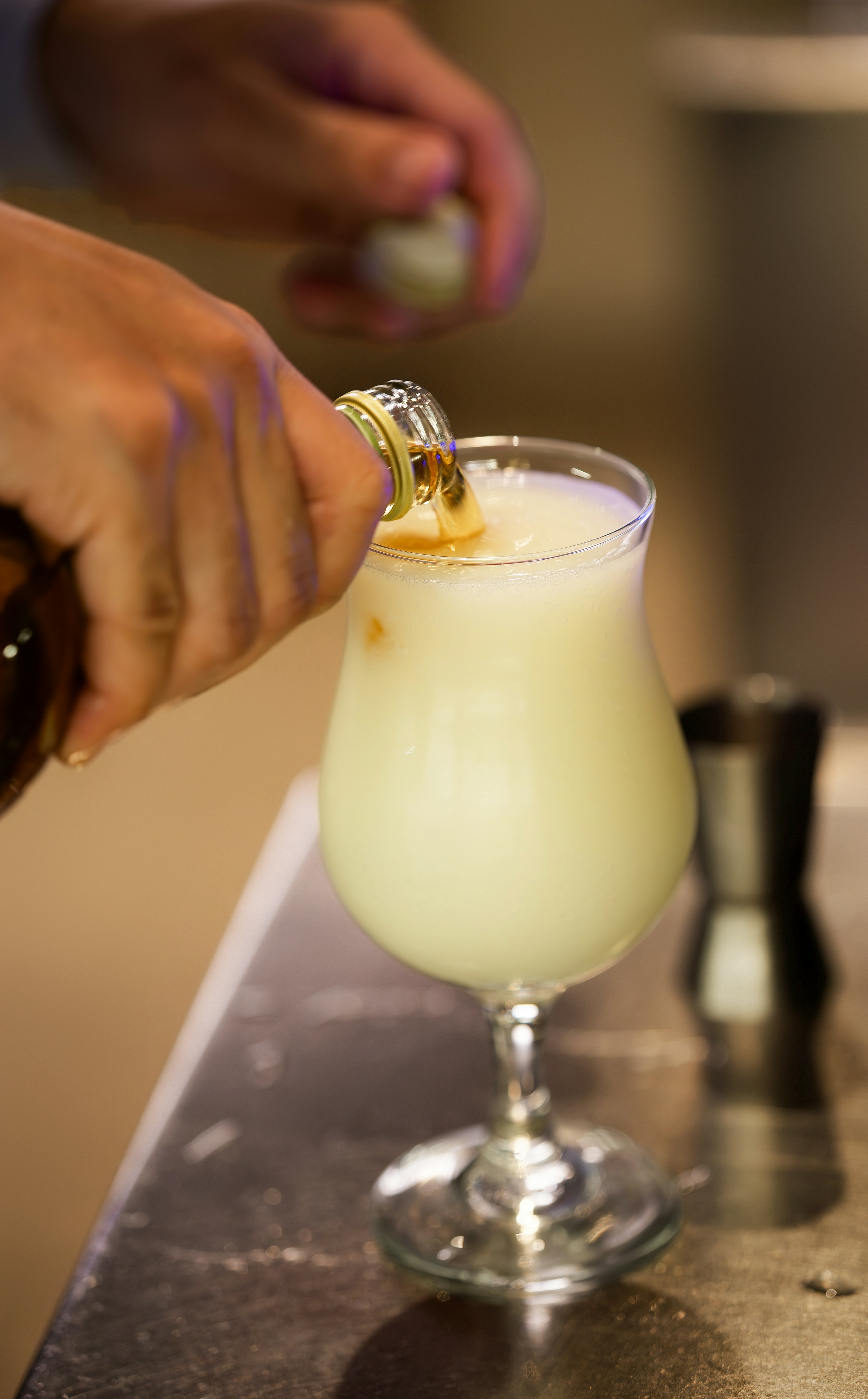 A Hands-On Pour: Crafting a Creamy Cocktail