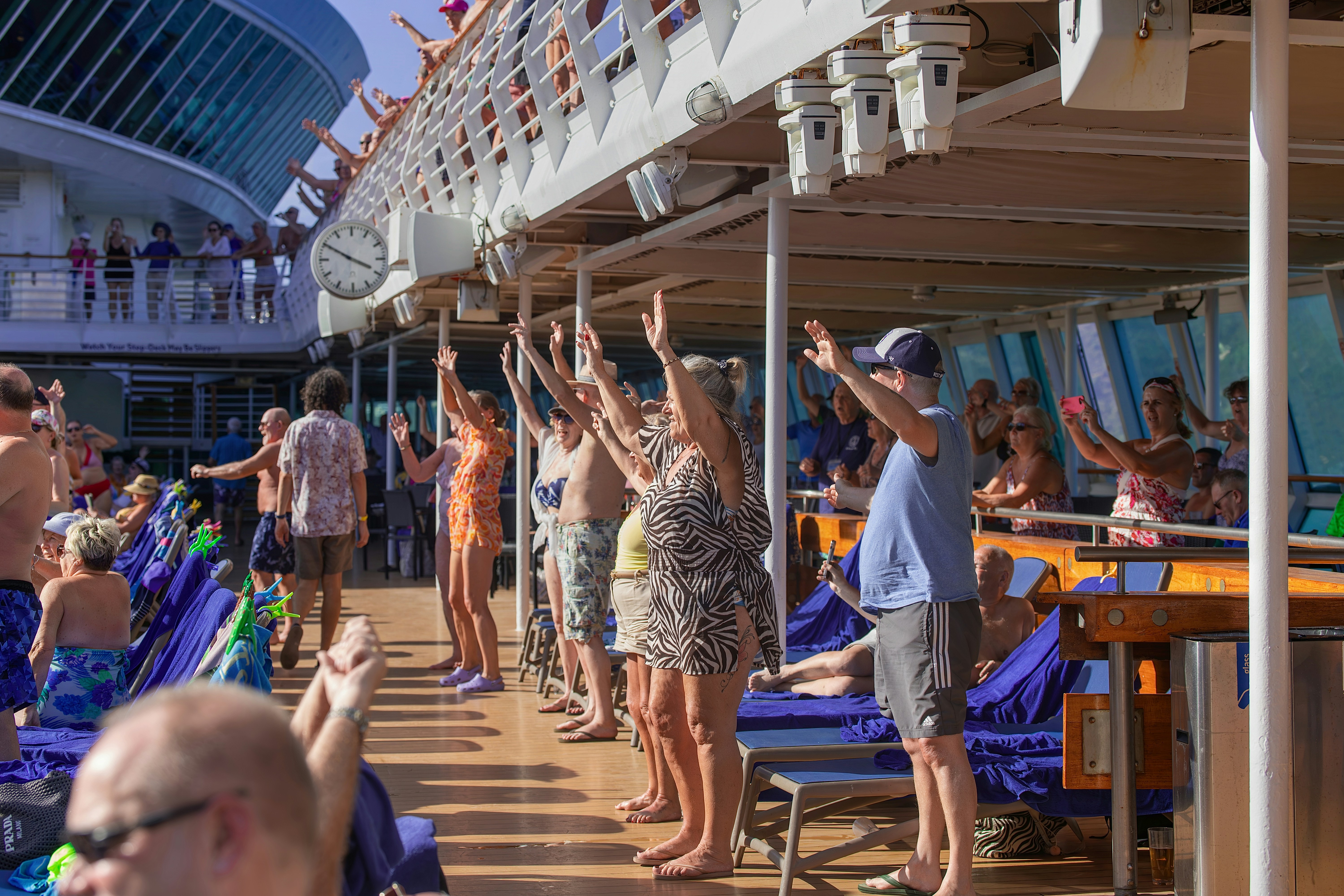 High-Altitude Cheer: Passengers Shoulder to Shoulder on a Cruise Deck