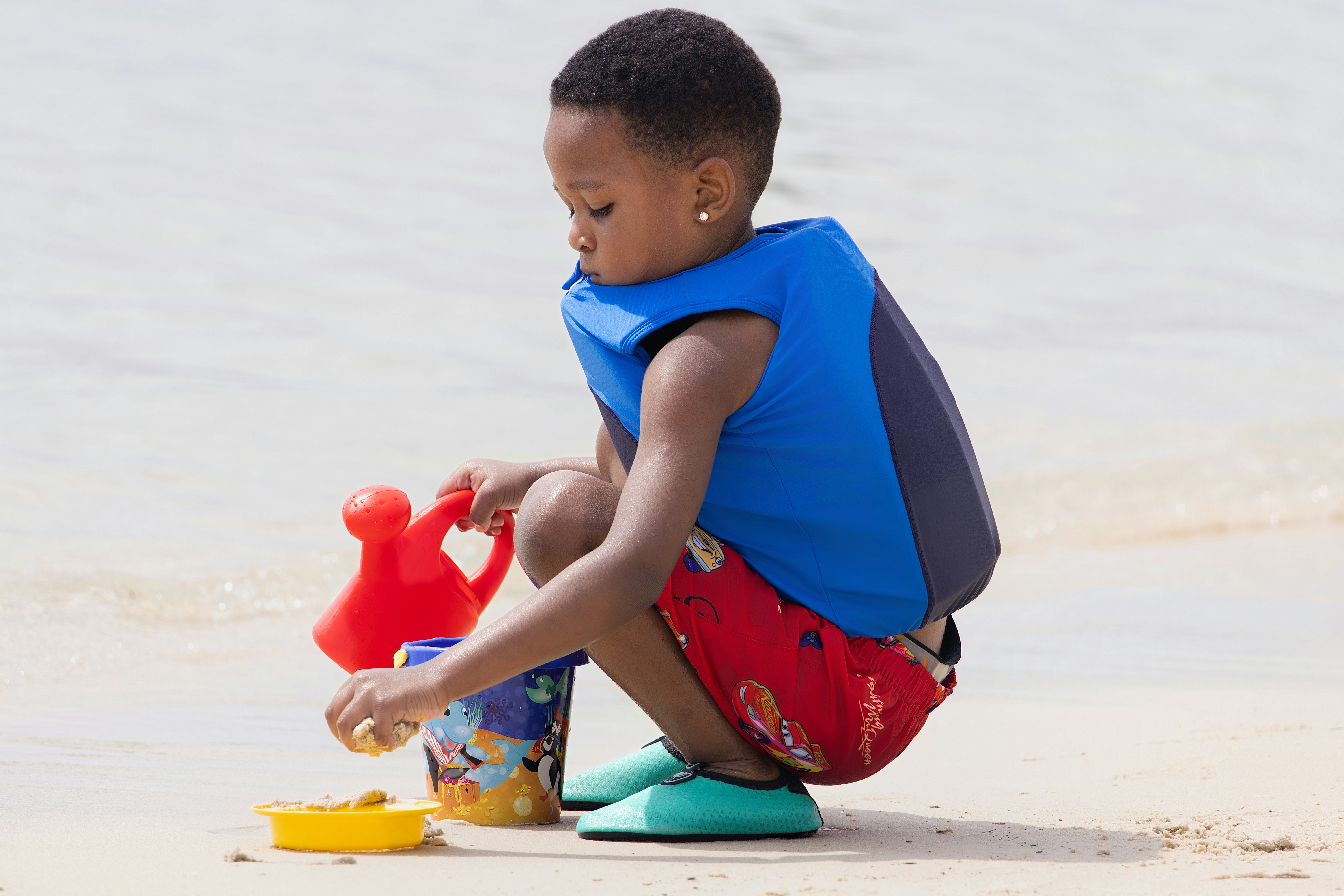 Little Beach Builder in a Blue Life Jacket
