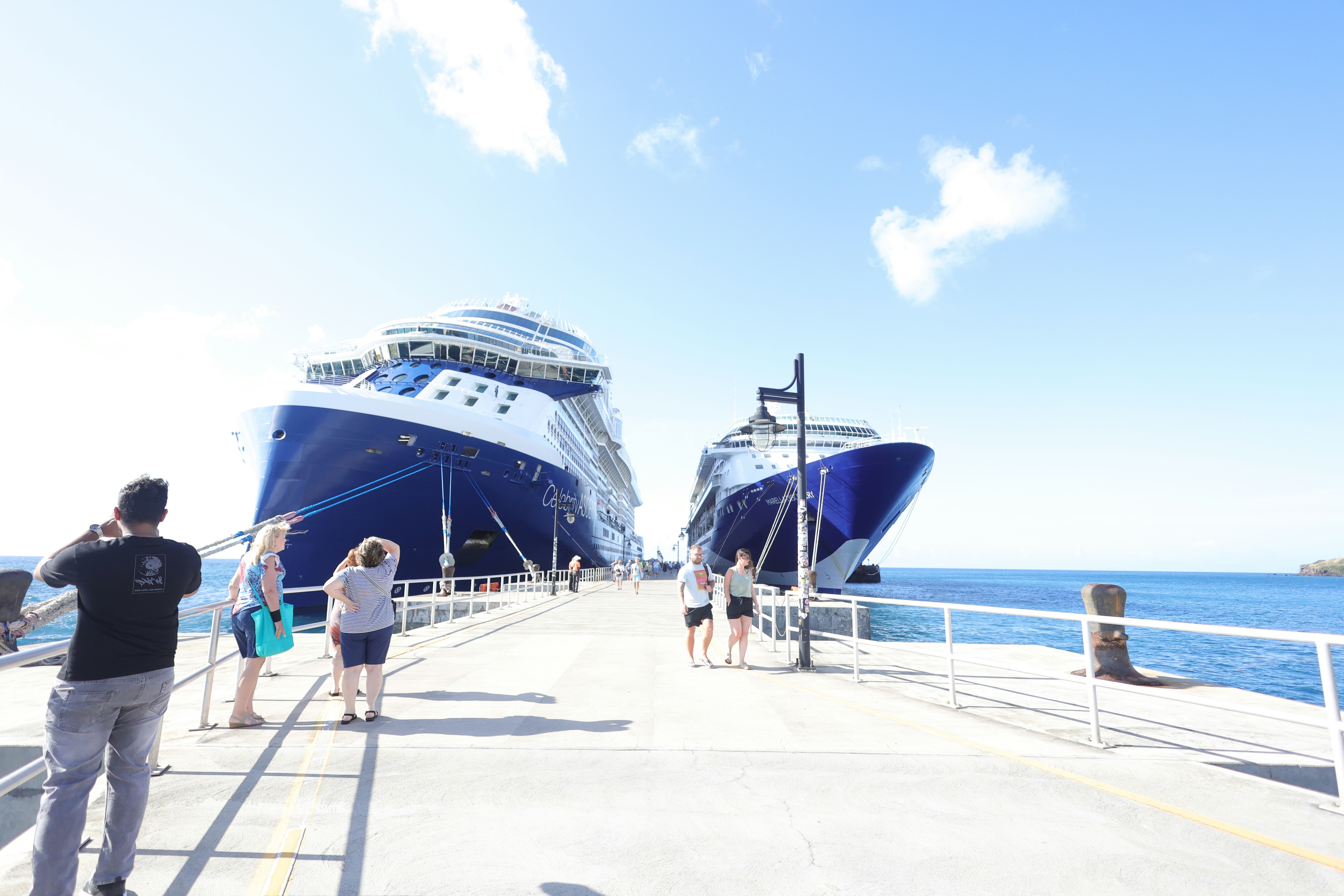 Symmetrical Arrival: Twin Yachts Docked at the Pier