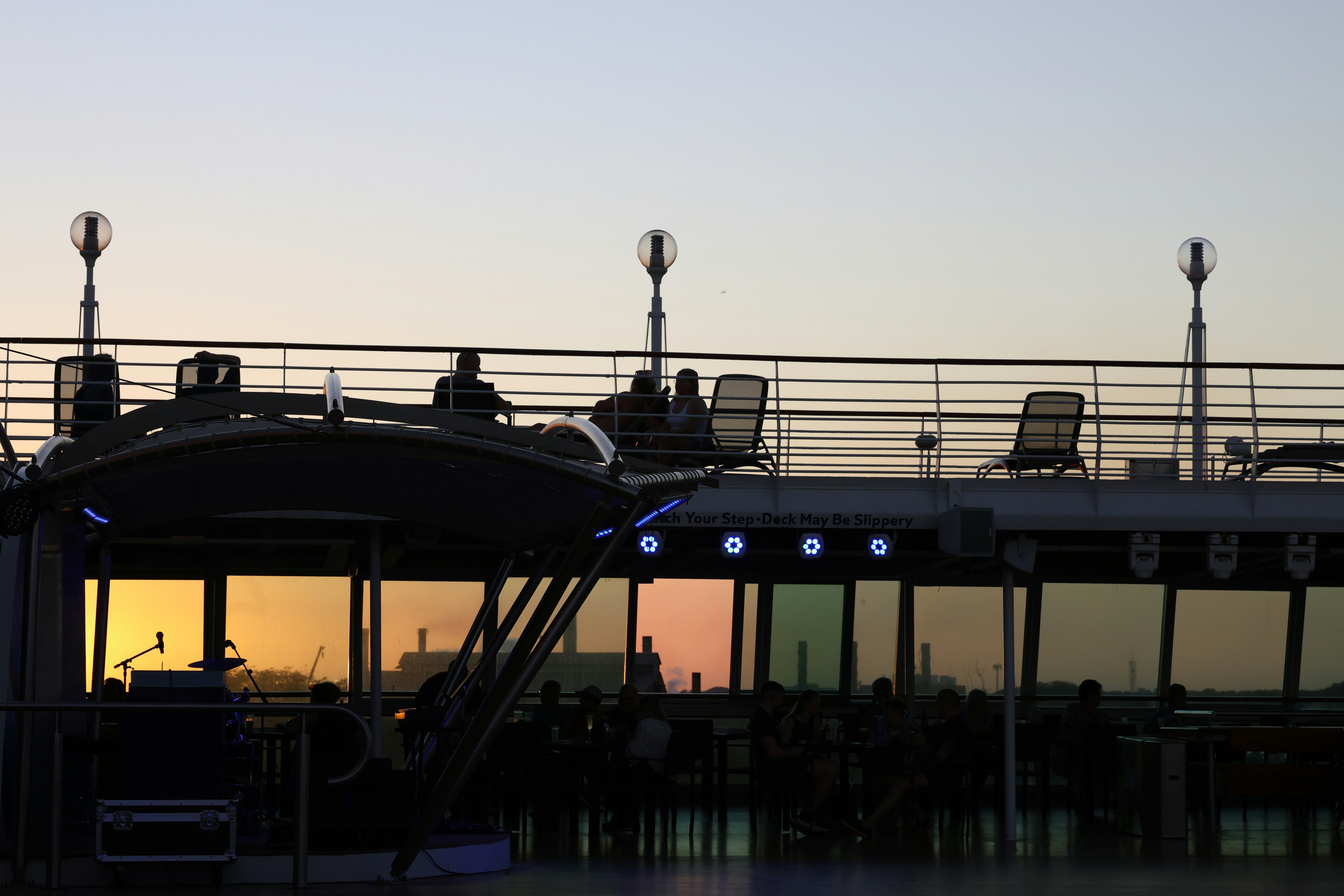 Sunset Silhouettes on a Maritime Deck