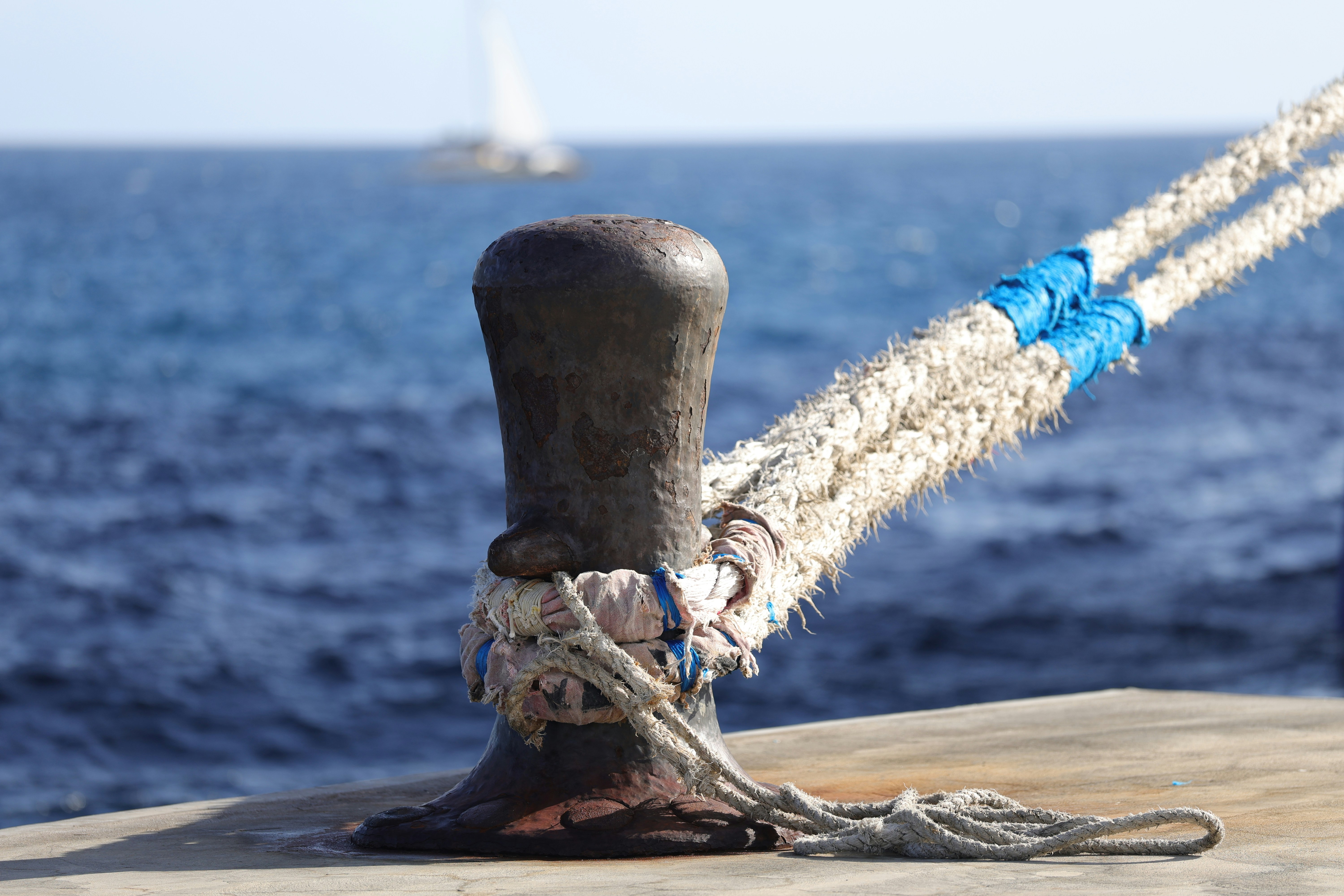 Rope and Mooring Post at Sea: A Quiet Moment of Nautical Detail
