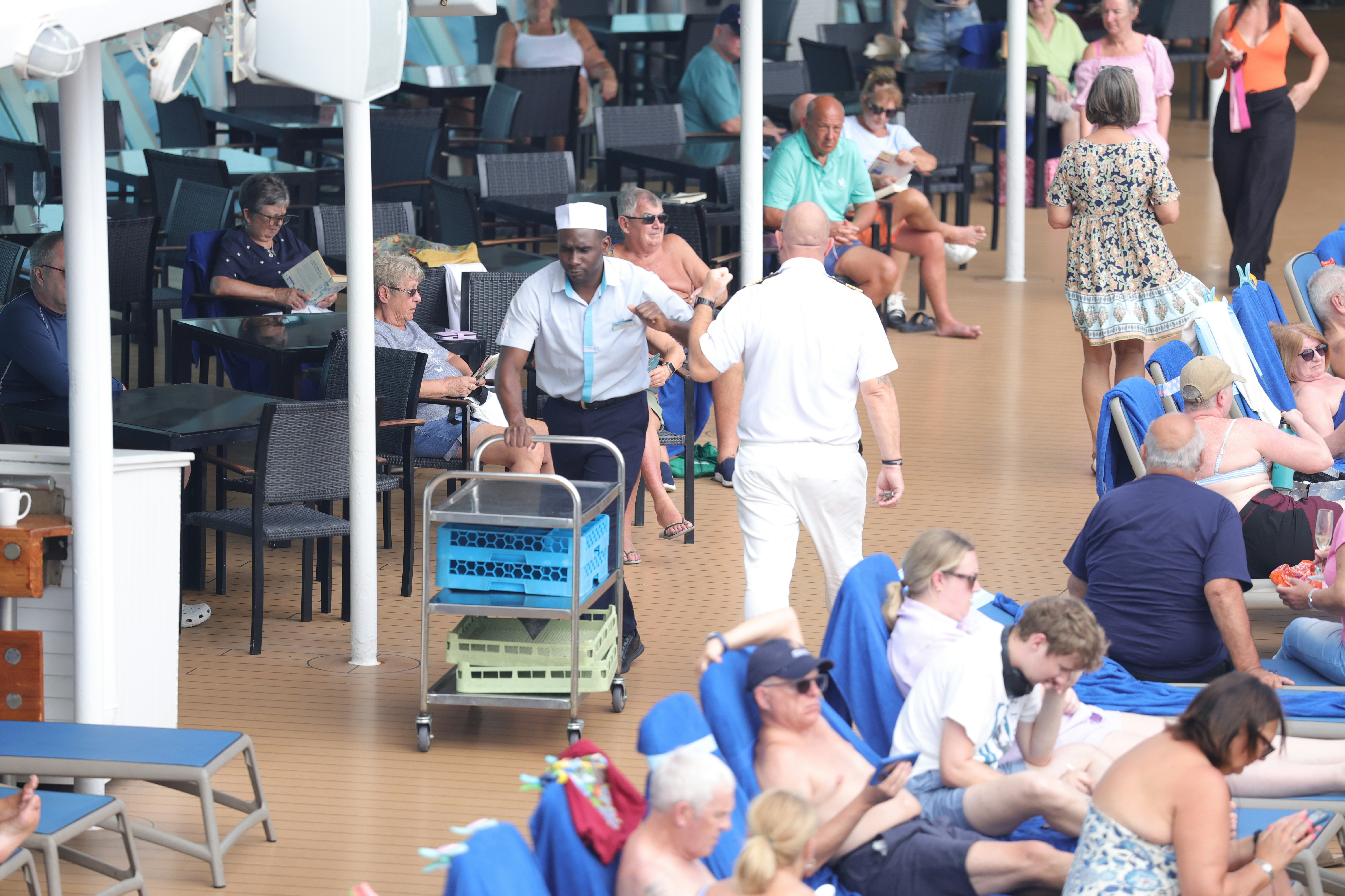 Laid-Back Sea-Deck Gathering: People, Sun, and Shade