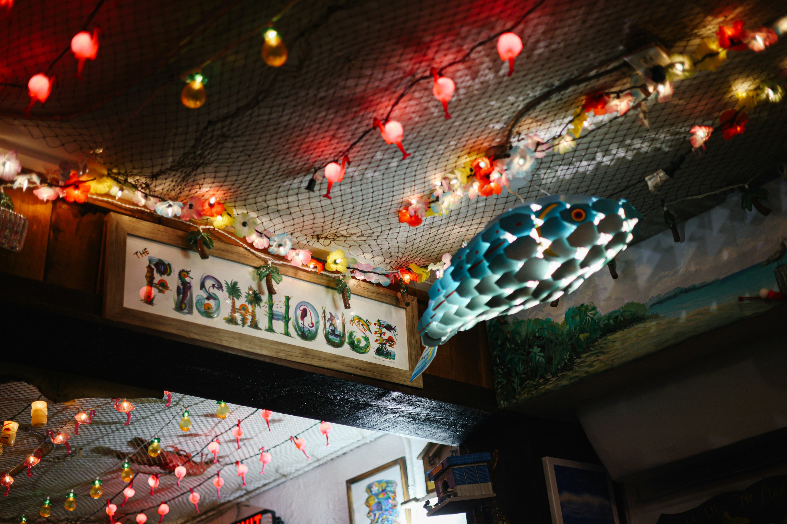 Floating Dim Sum of the Deep: A neon-lit fish sails above the cozy dive