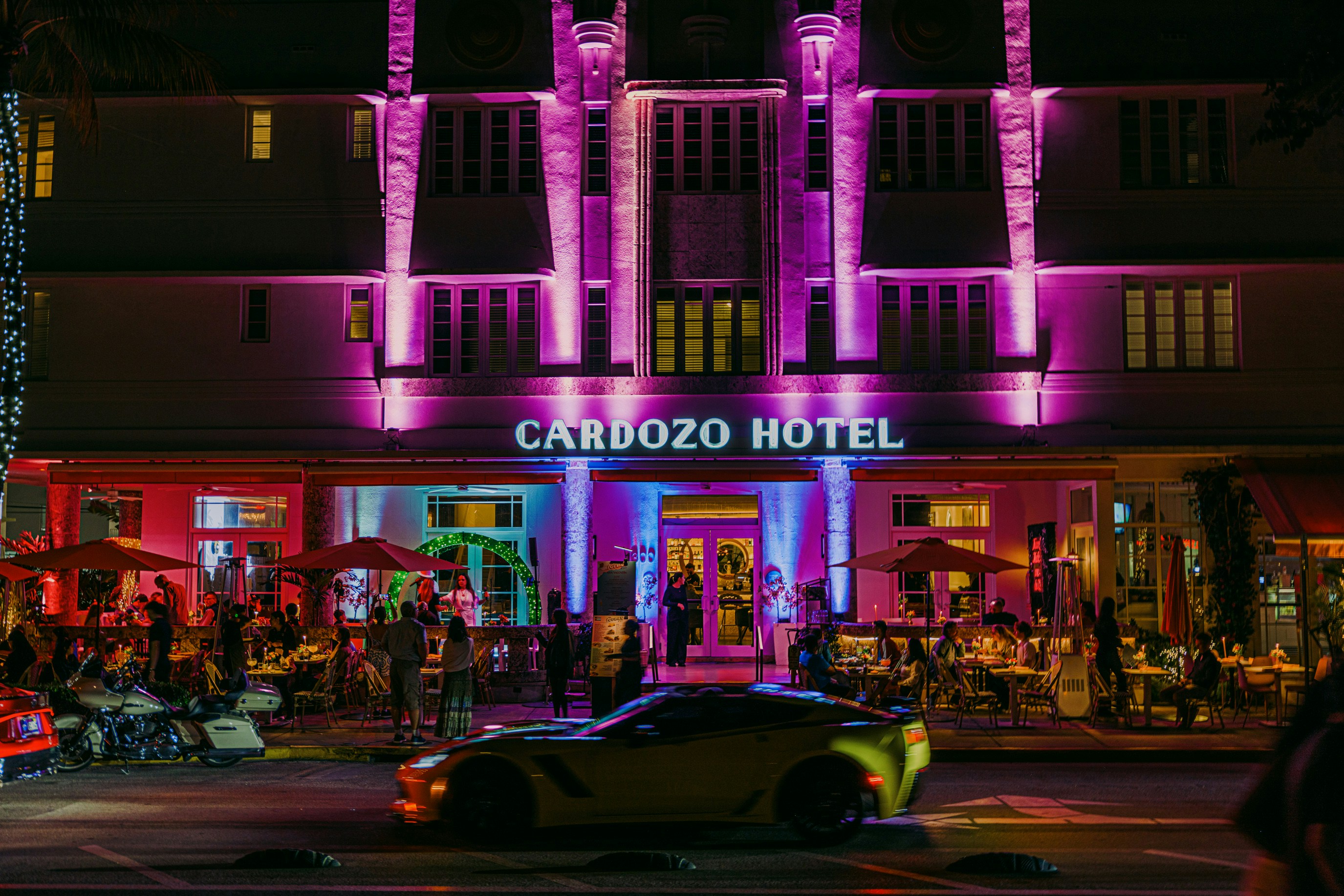 Neon Night at Cardozo: Entrance Lit in Violet and Blue