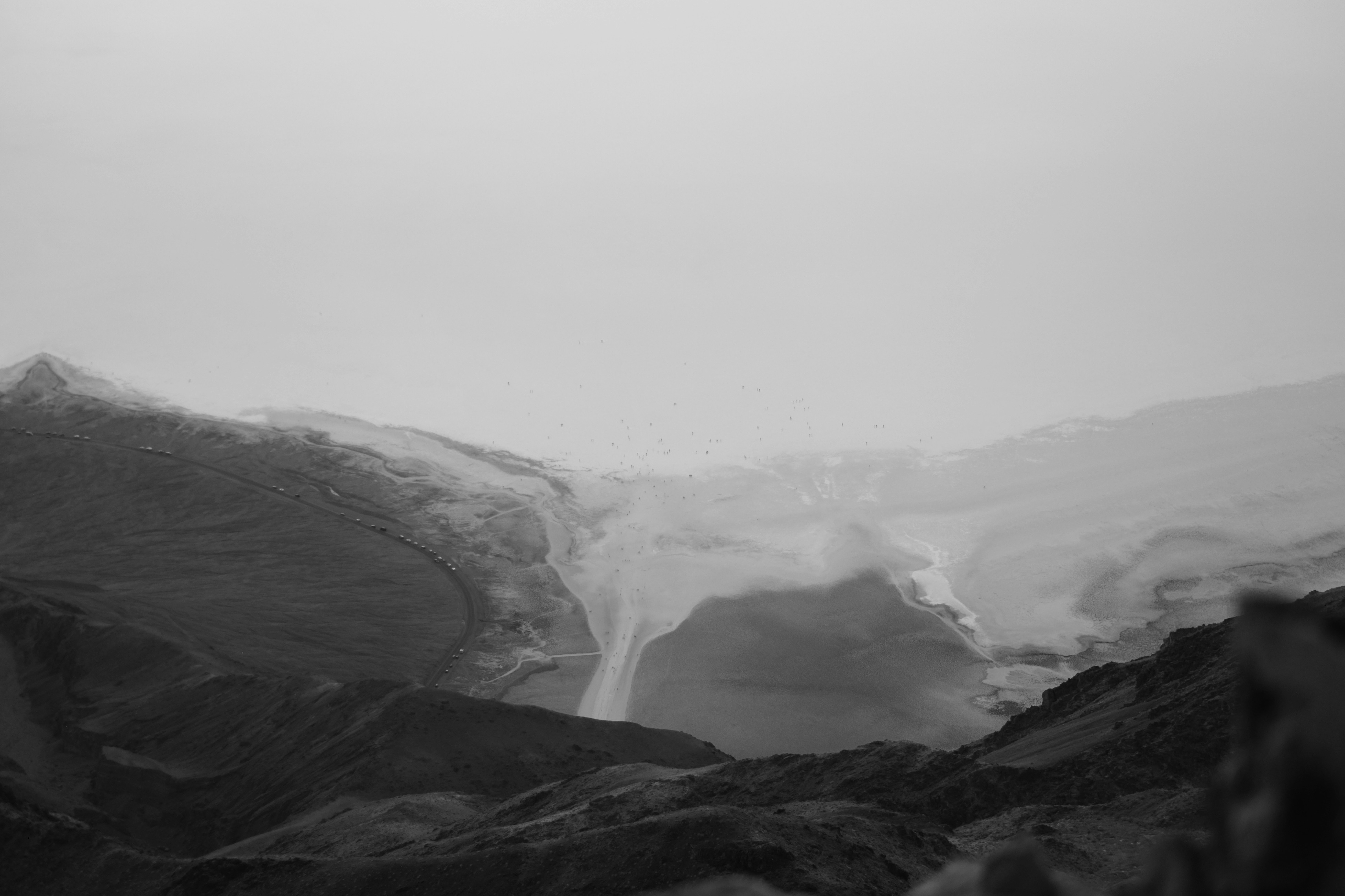 Coastal Fjord Curtain: A Monochrome Convergence at Dusk