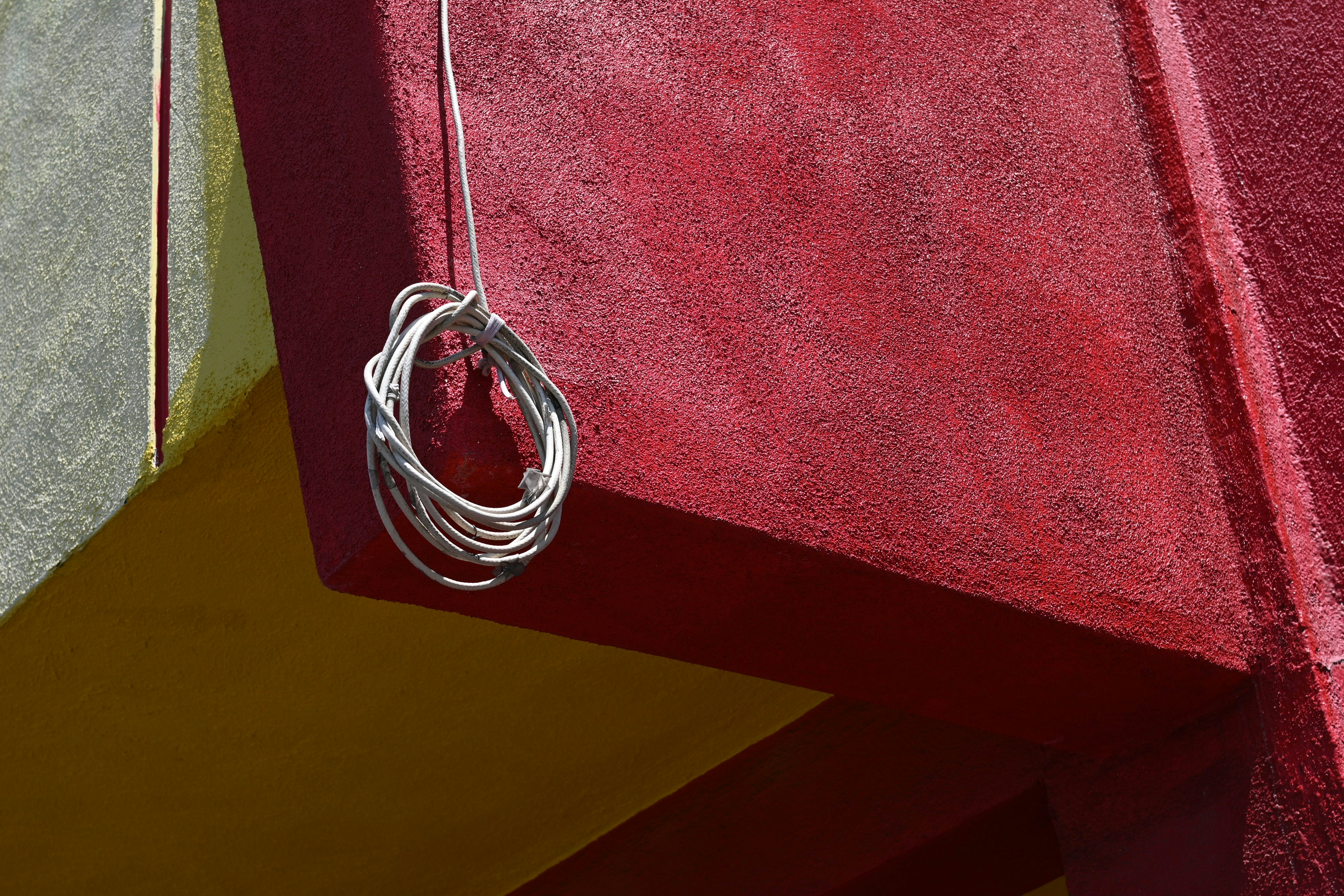 Coiled Wire Against a Geometric Facade