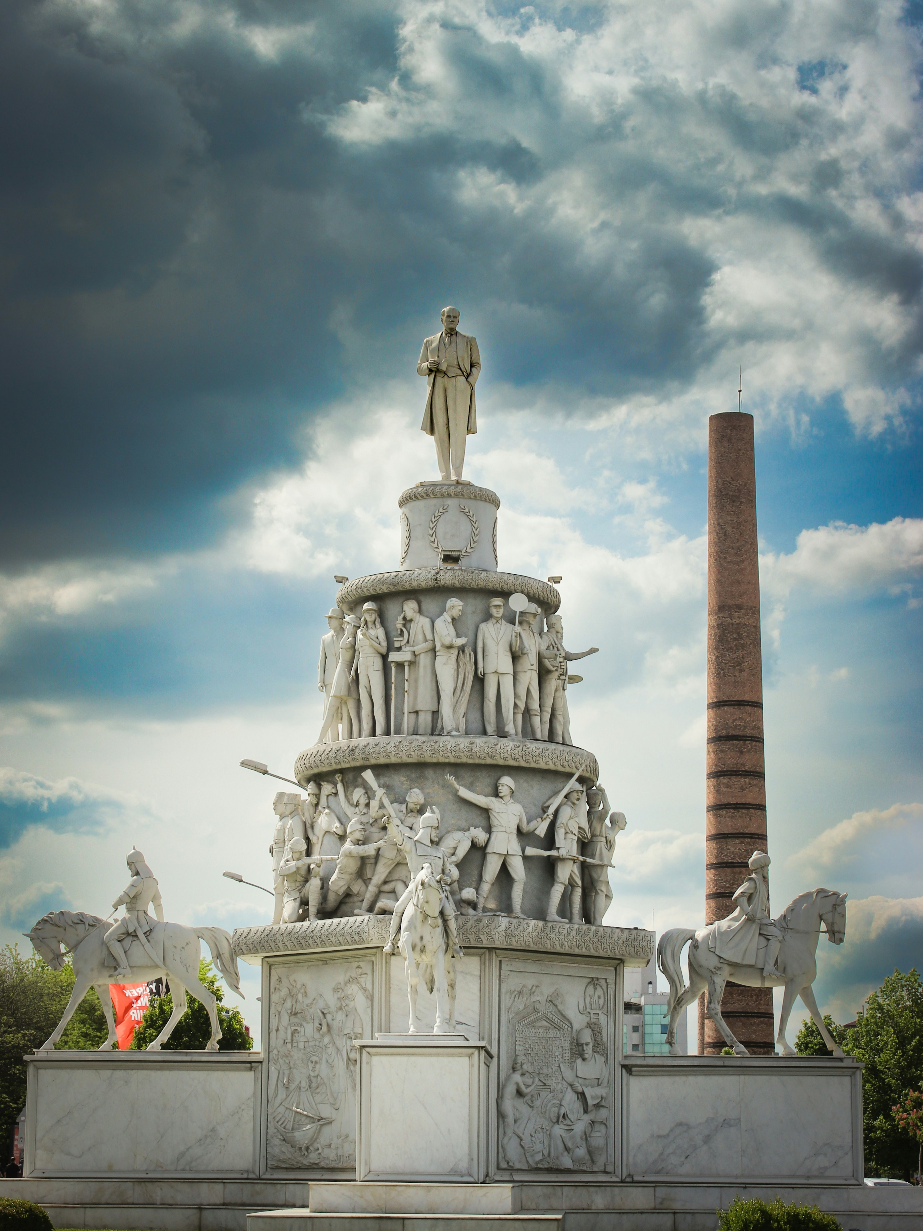 Statue Cascade: A Monumental Ensemble Under Dramatic Skies