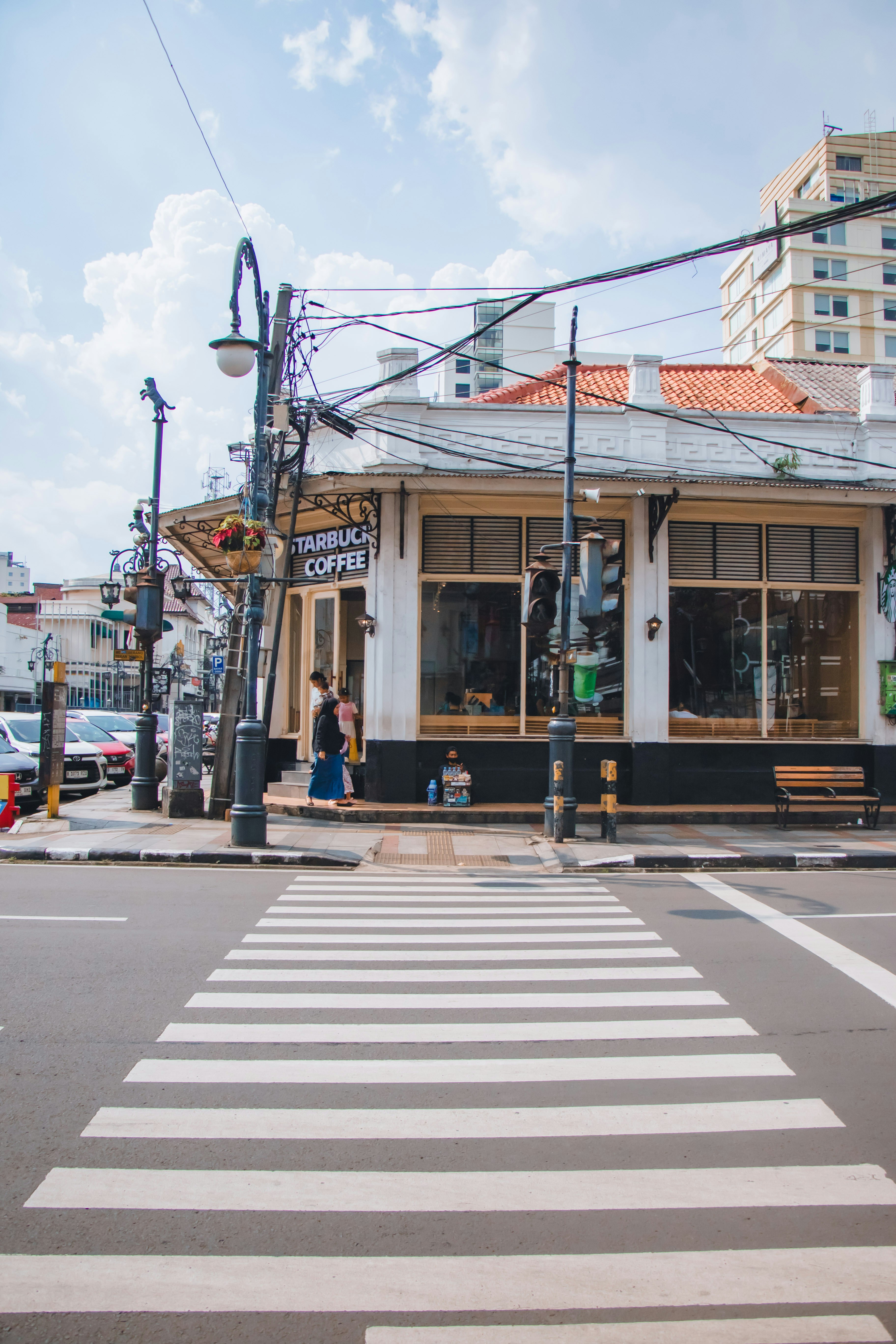Corner Coffee Café at a Sunlit Crosswalk