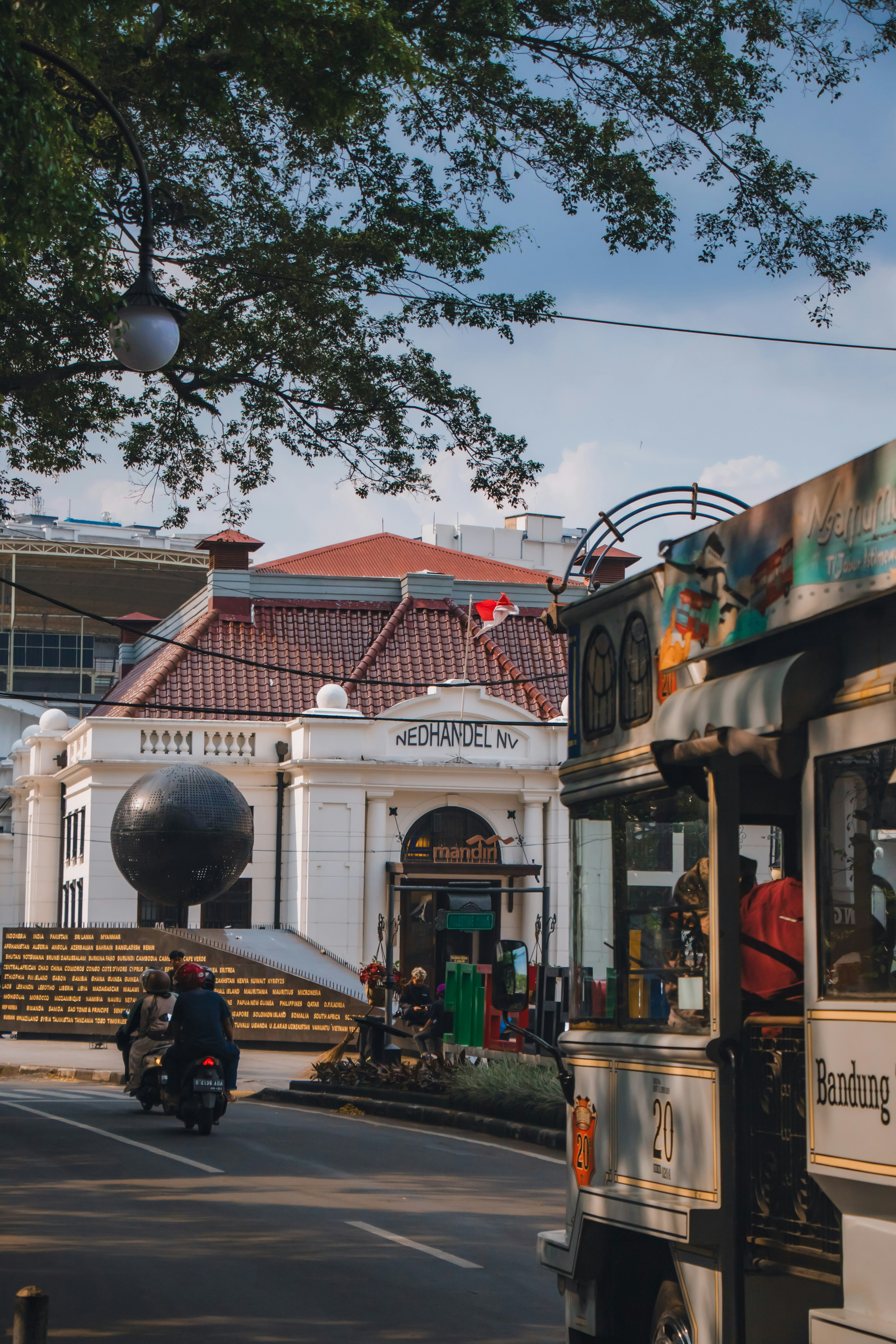 City Bus and Neo-Classical Arcade: A Quiet Street Scene