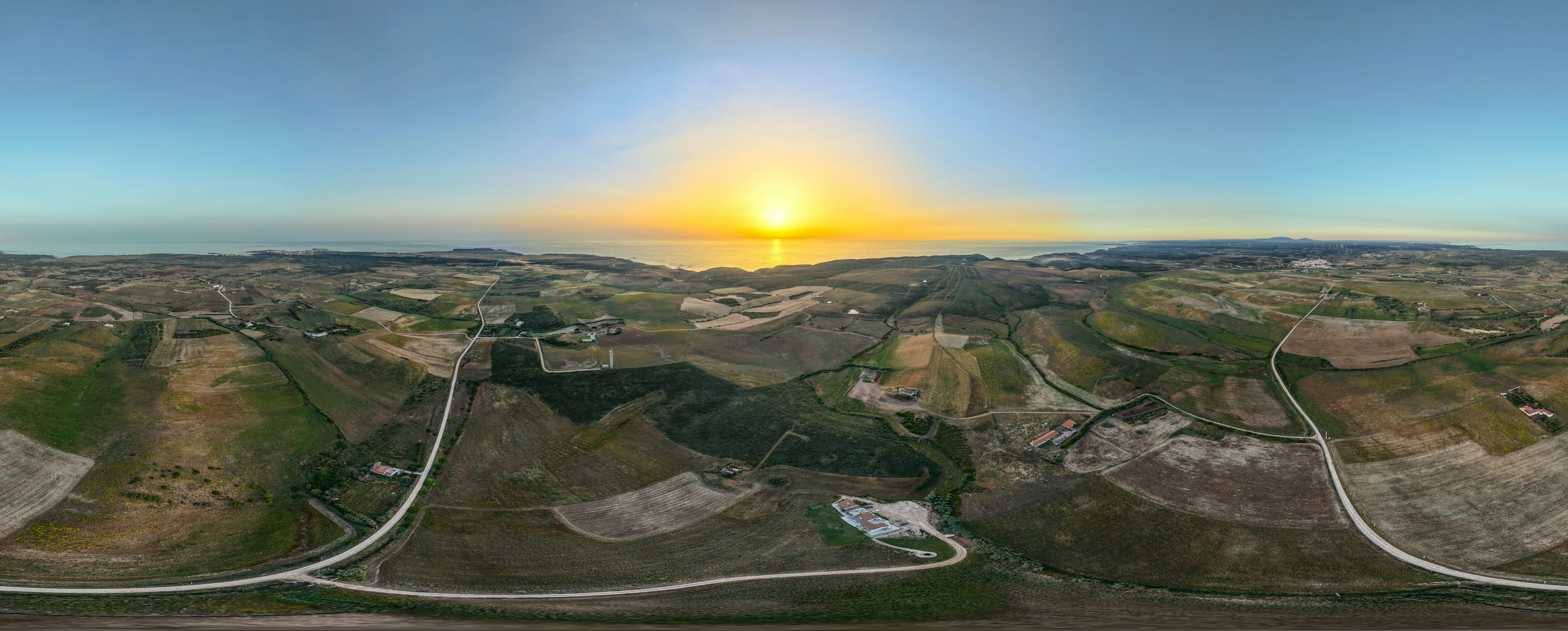 Sunrise over a Ribbon of Rolling Hills and Valleys
