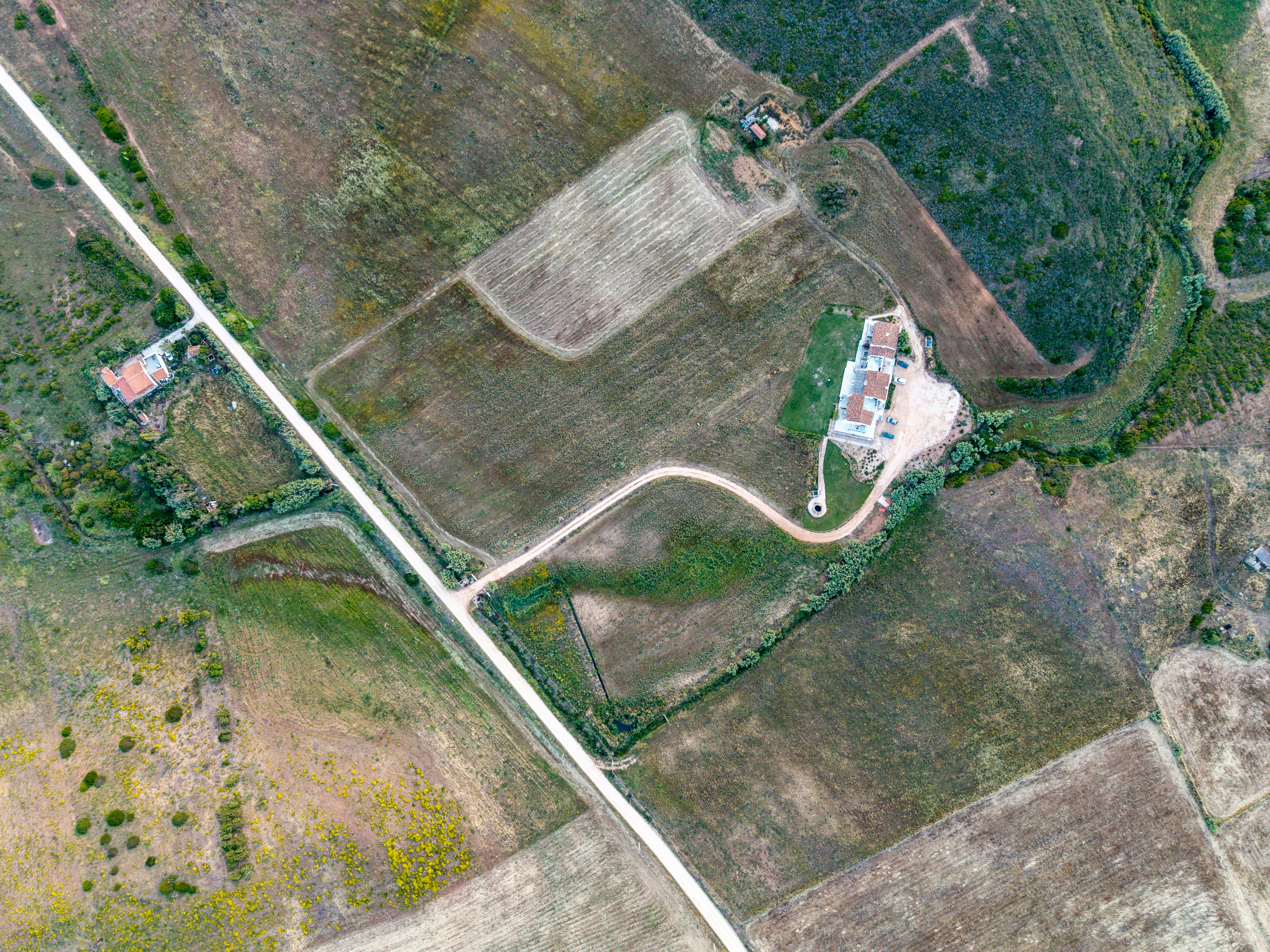 Rural Geometry: A Farmstead Nestled Among Patchwork Fields