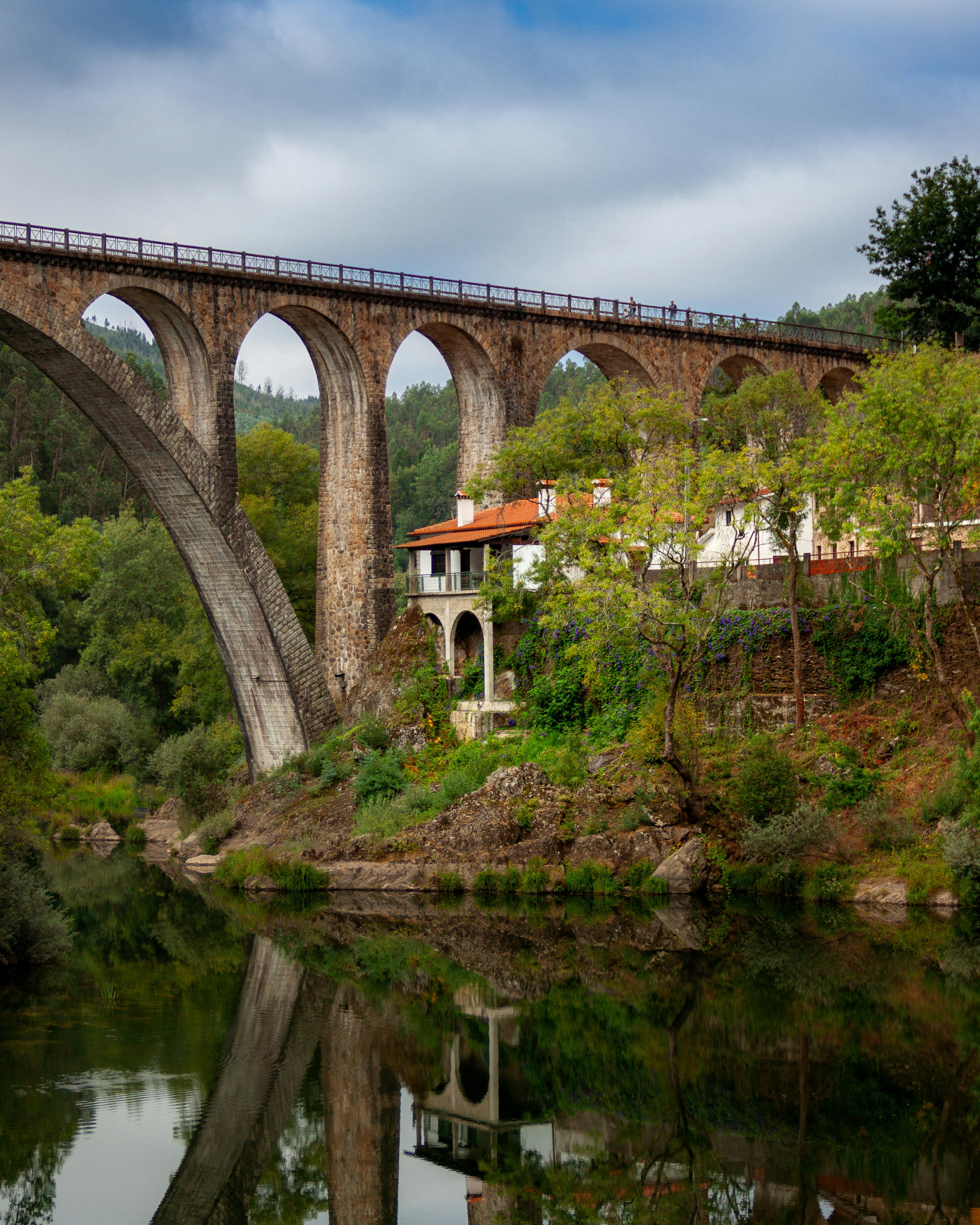 Stone Archways over Quiet Waters: A Riverside Viaduct
