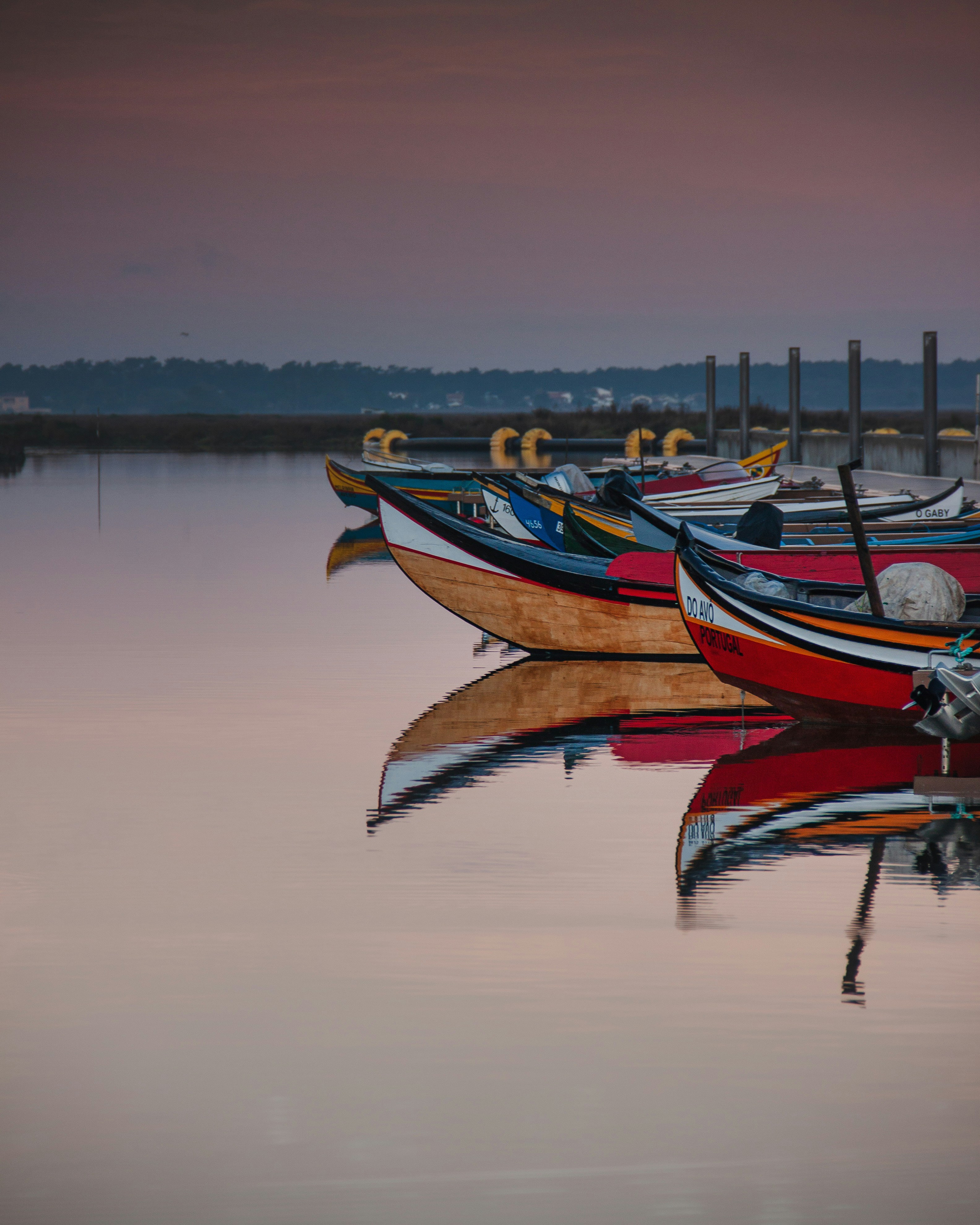 Colorful boats Resting at Dusk on a Glassy Inlet