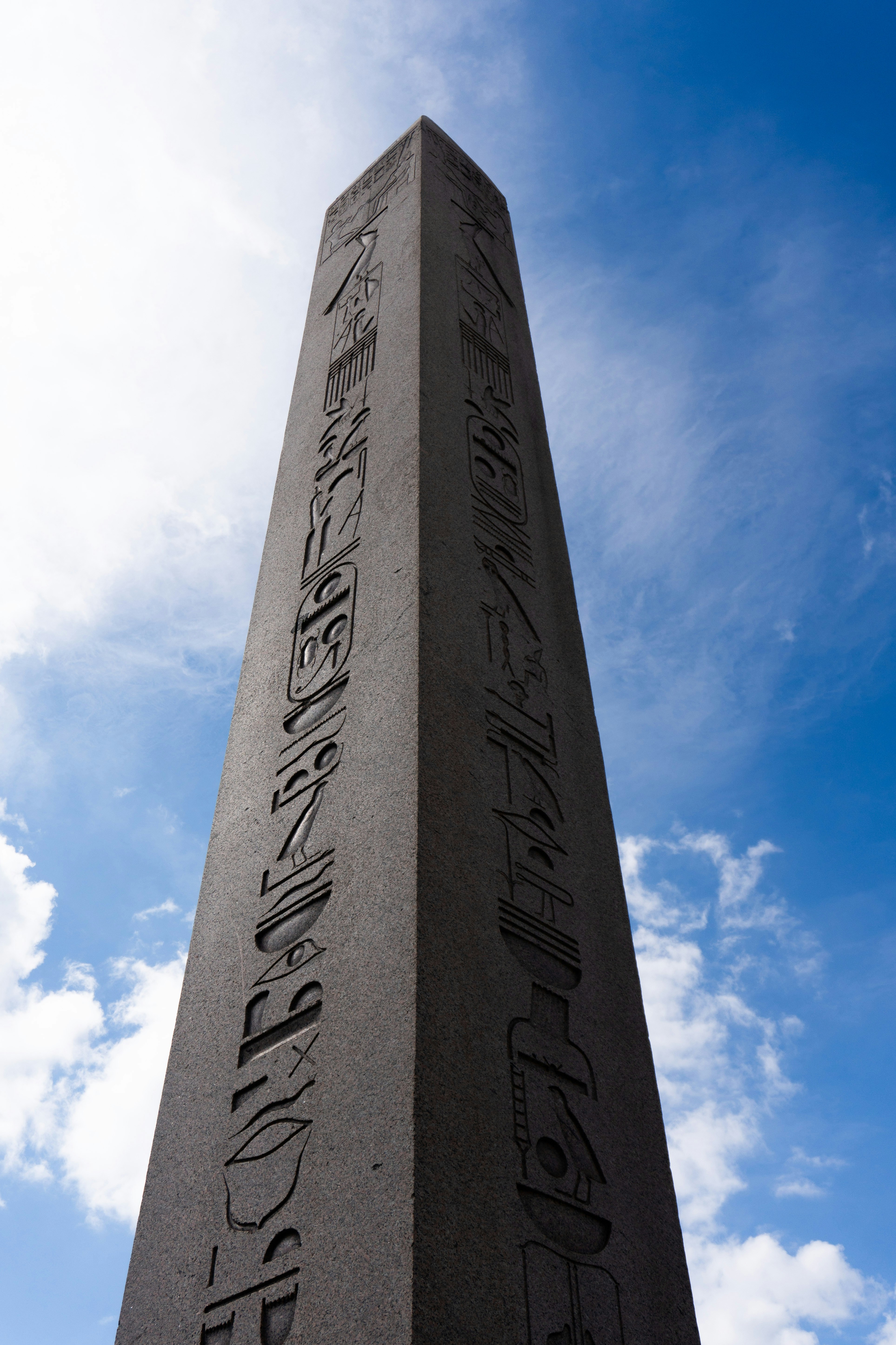 Obelisk of Echoes Reaching Toward a Cobalt Sky