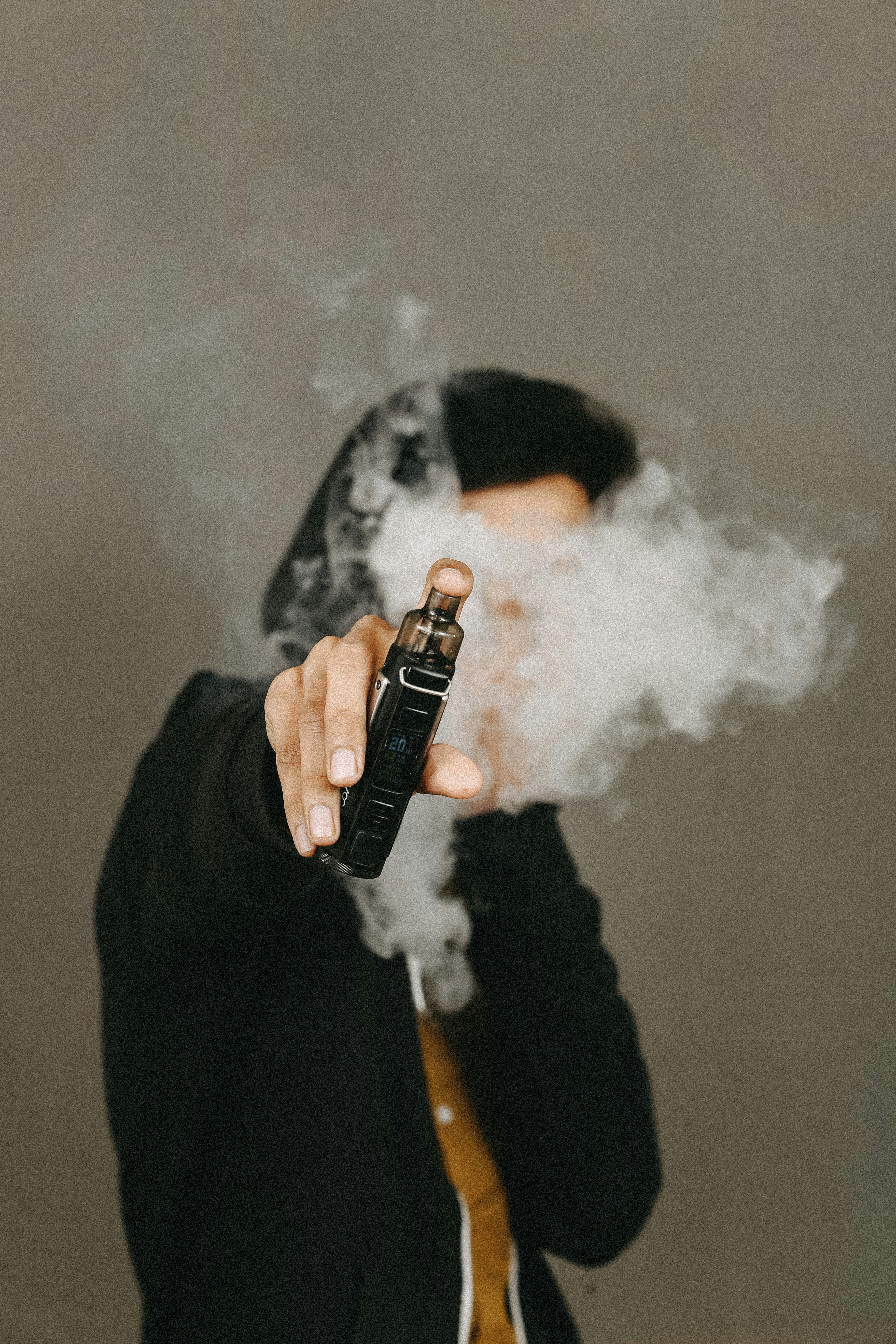 Vape in Hand, Hidden Face: A Privacy-Focused Portrait in Smoke