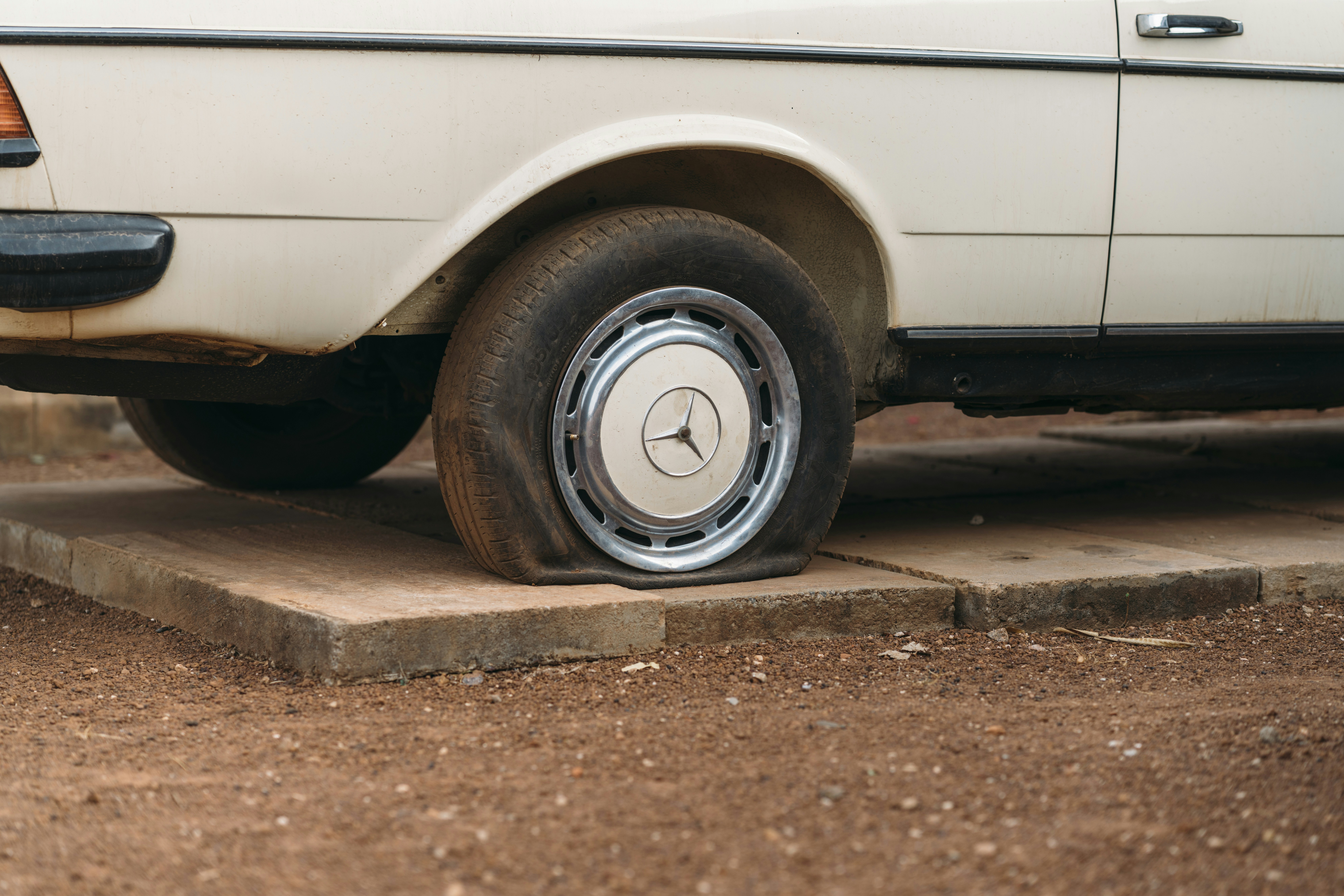 Mercedes-Ceded Quiet: A Close-Up on a Vintage Hubcap