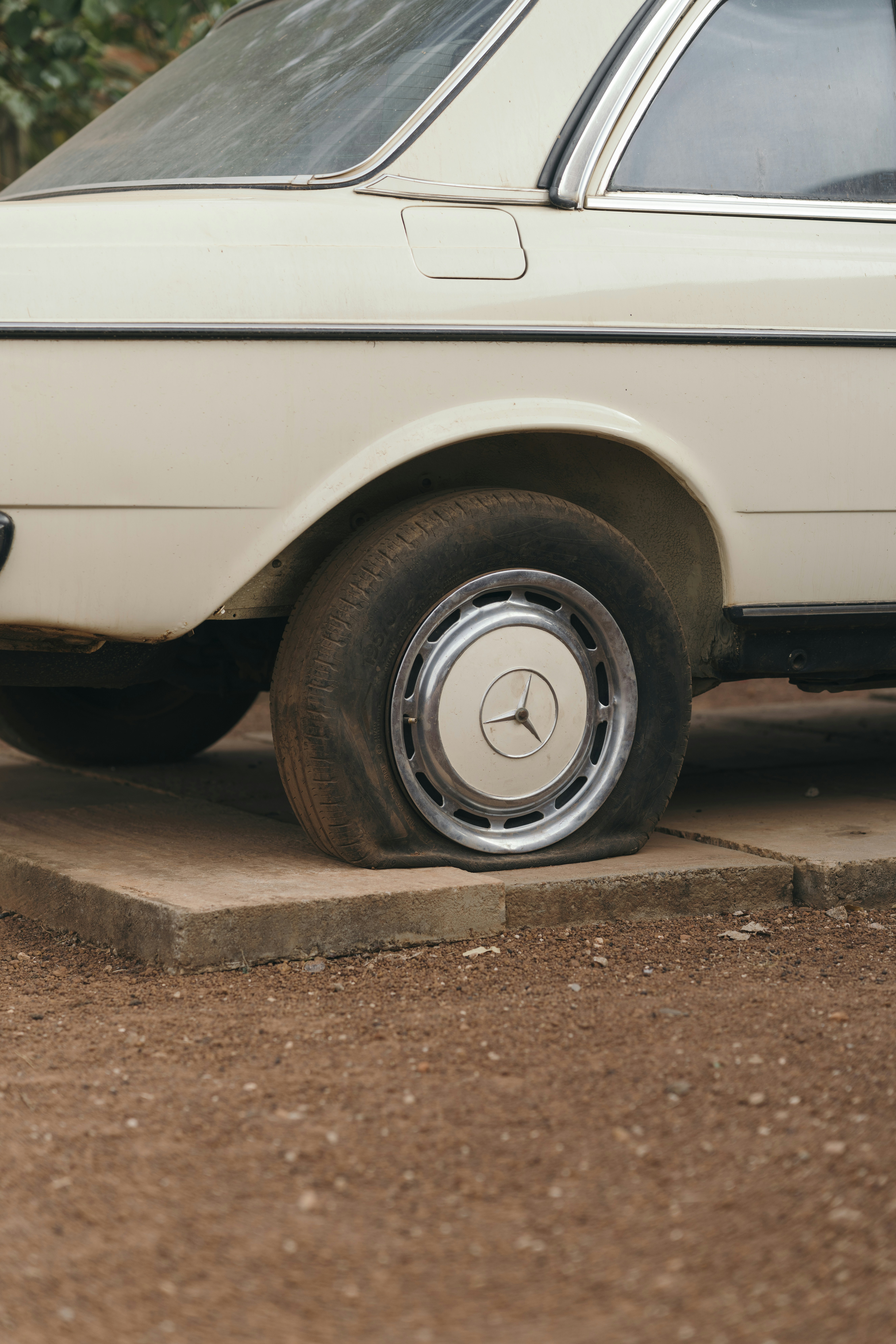 Wheel Well Reverie: A Quiet Moment with a Classic Mercedes