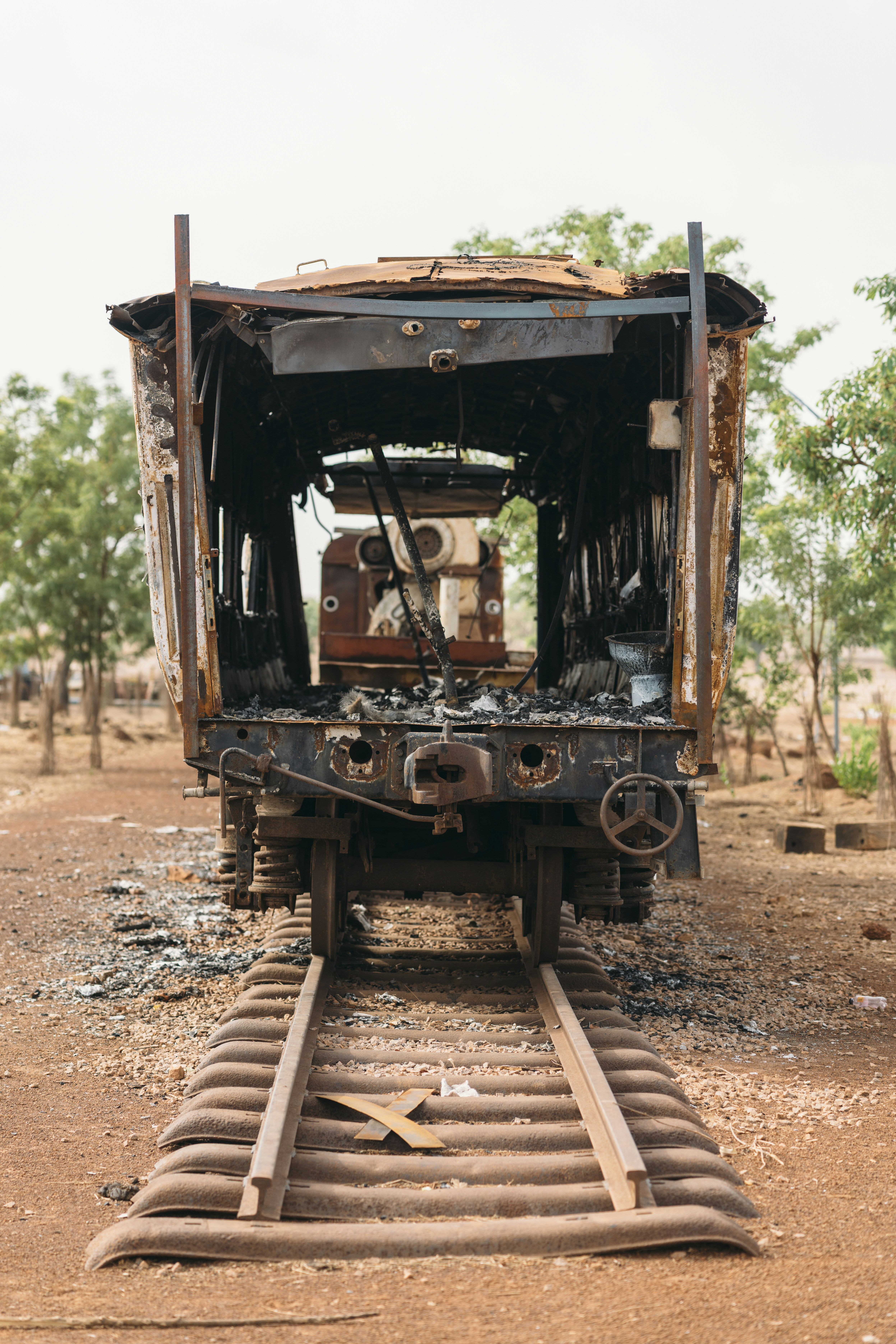 Charred Remnant on a Broken Rail