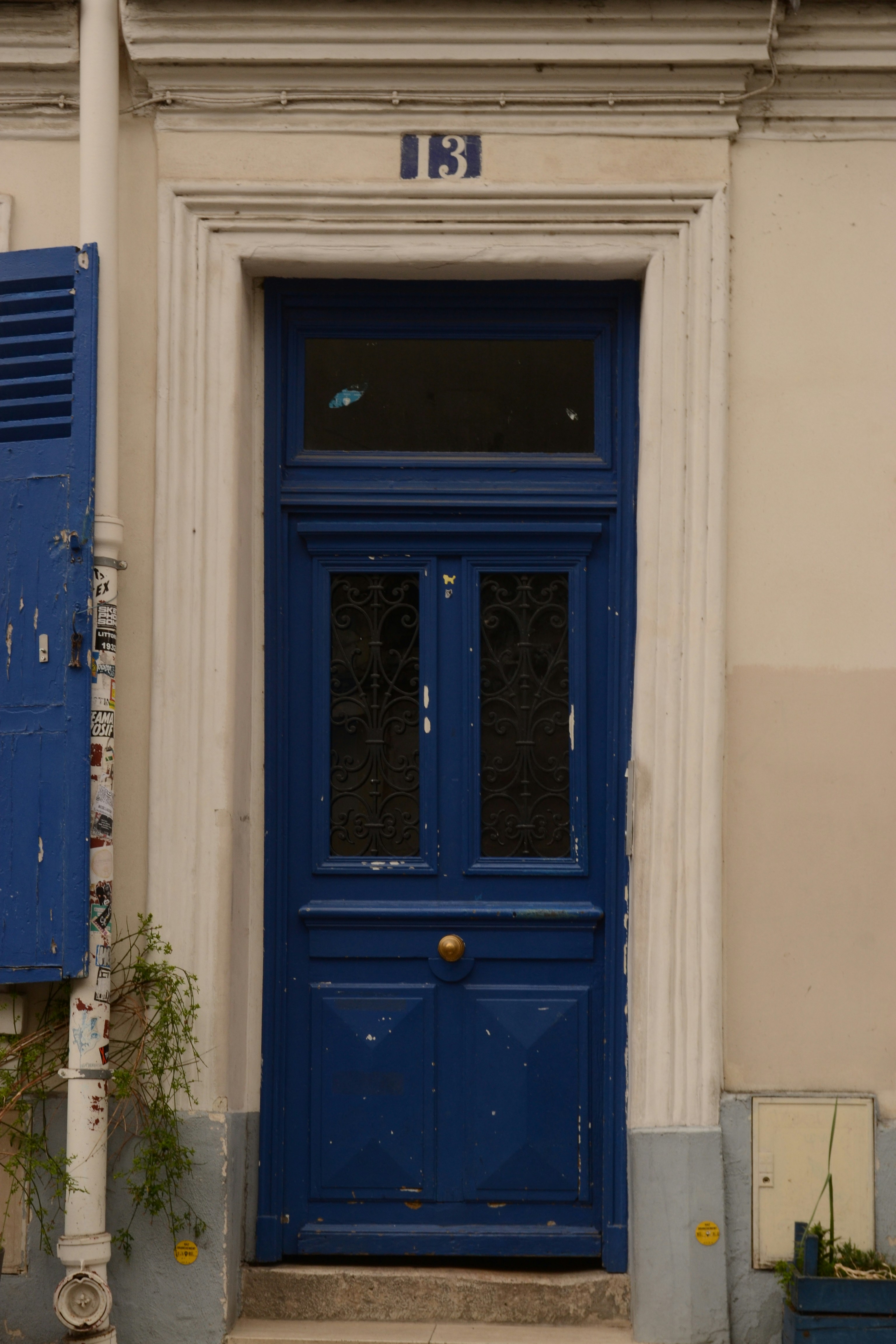 Blue Door at Number 13: A Colonial Facade in Quiet Street