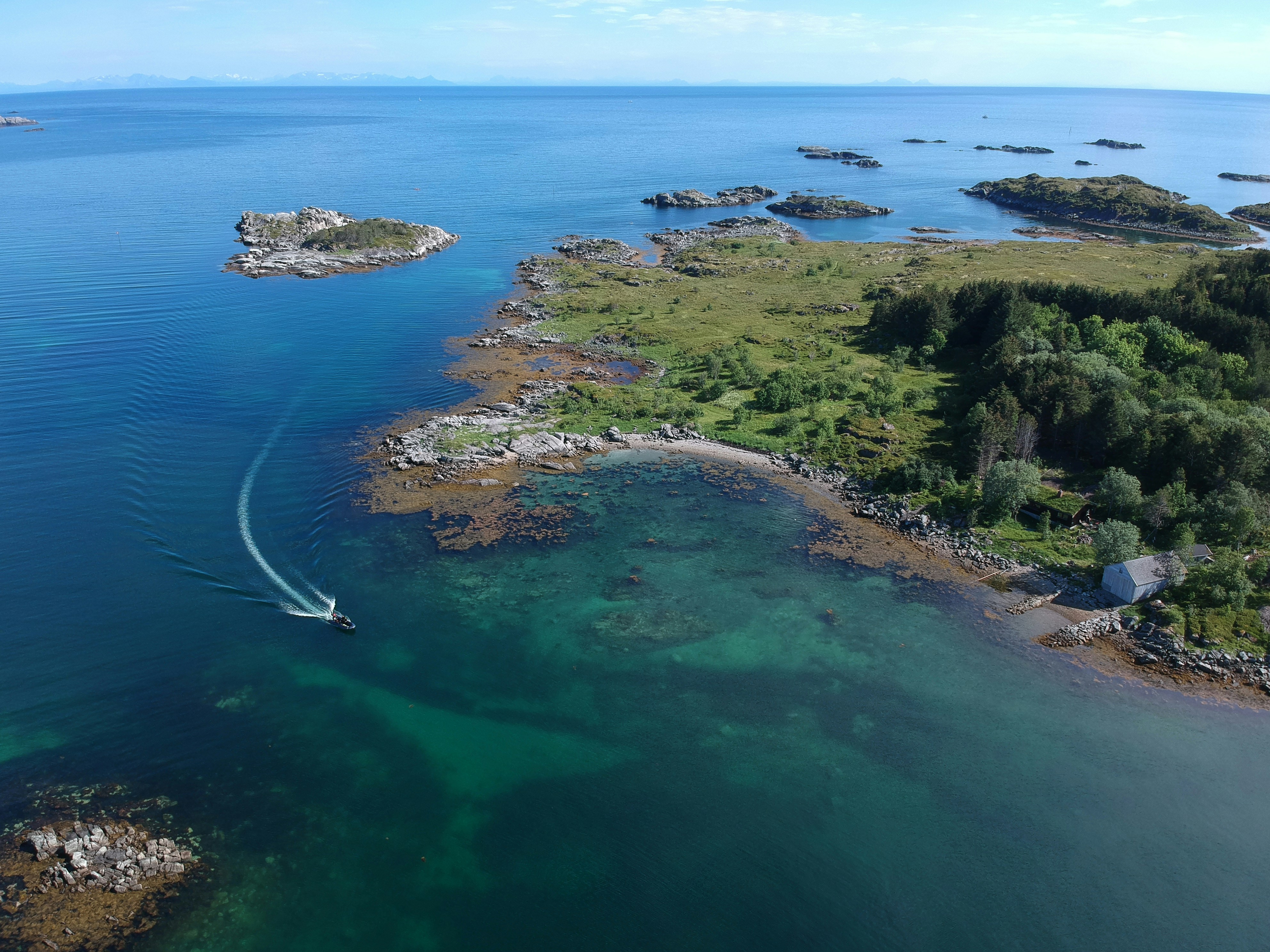Coastal Jet: A Boat Slice through Turquoise Waters