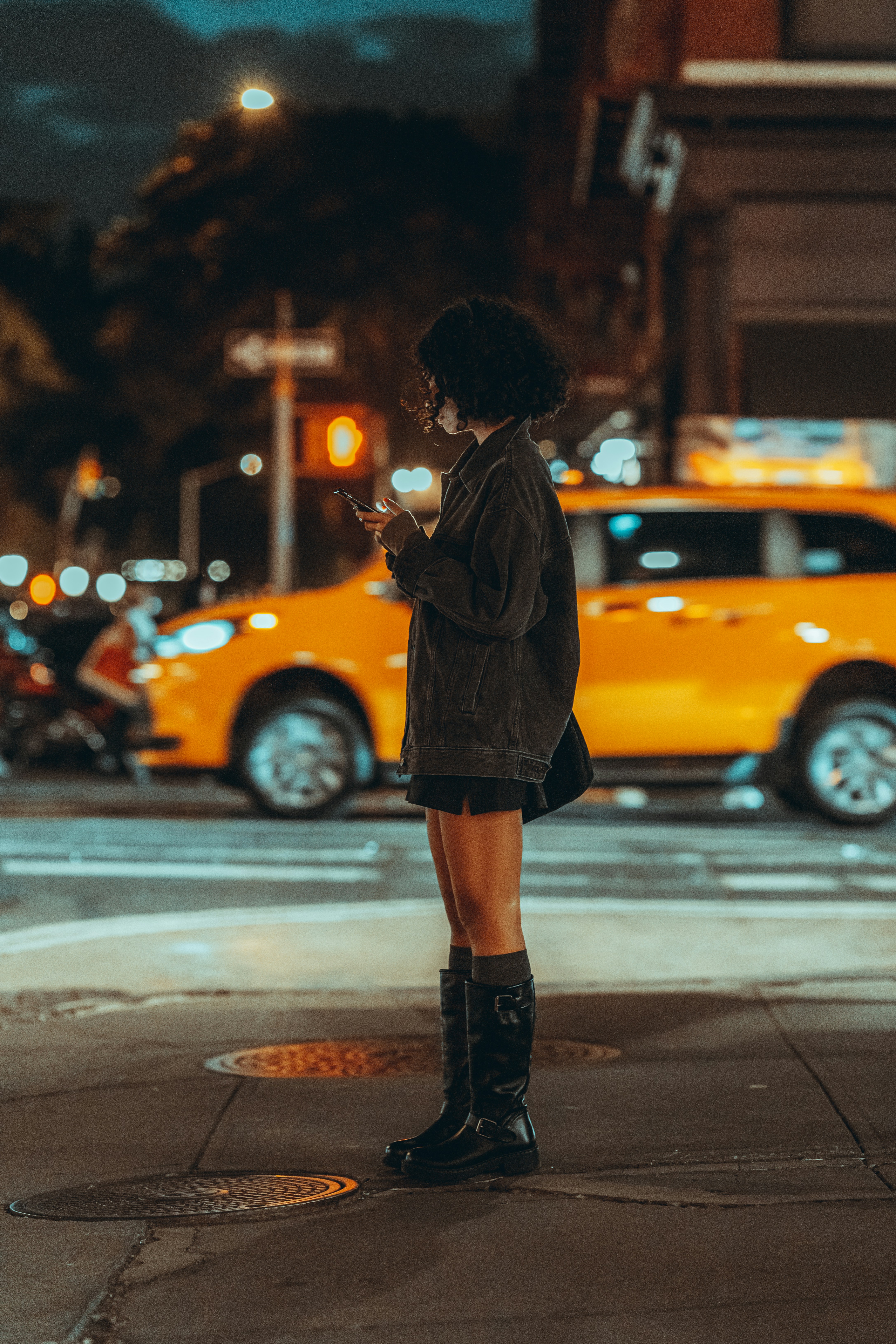 Neon Night Stroll: A Figure in Focus on a City Street