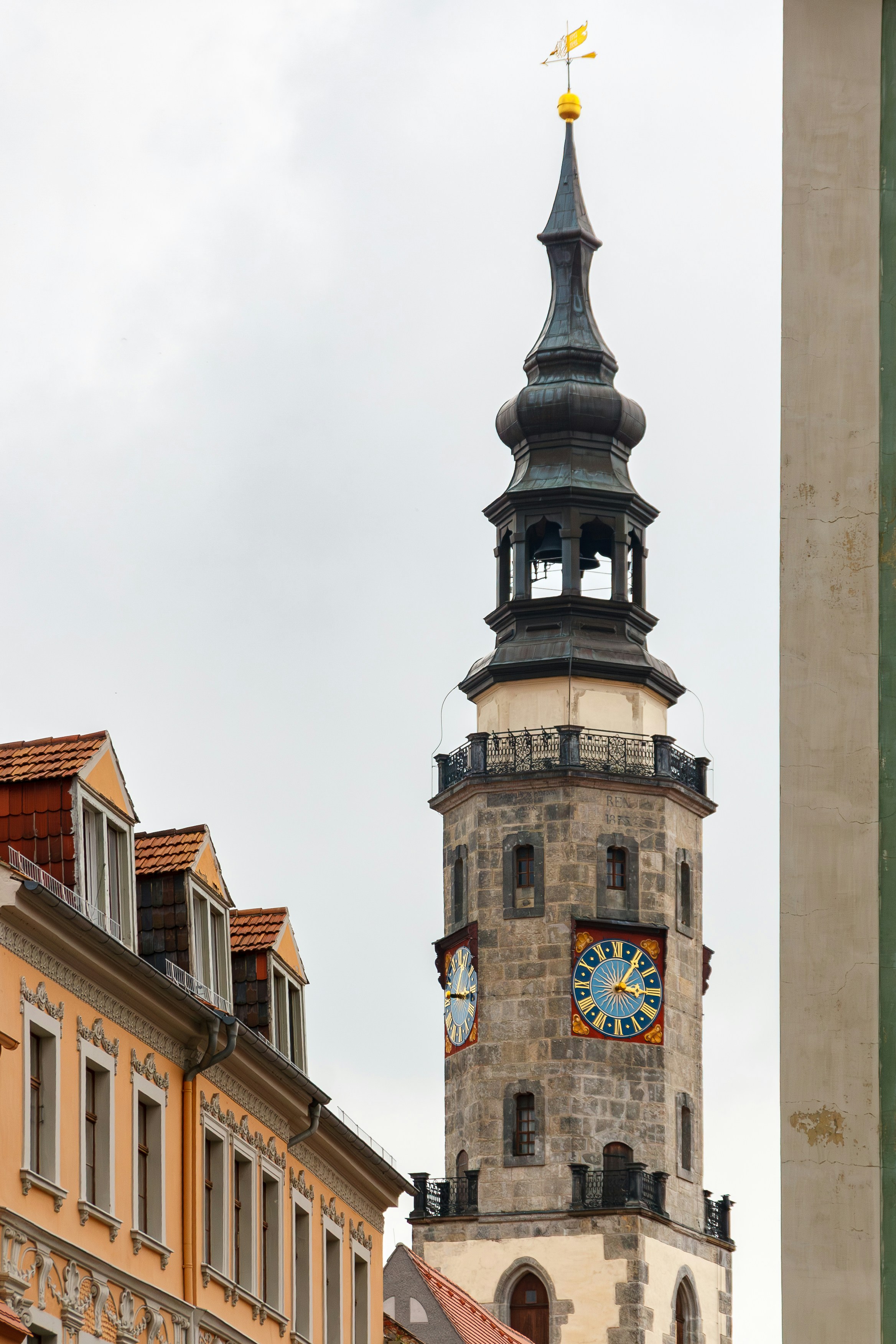Tower Clock and Spire Rising Above a Historic Townscape