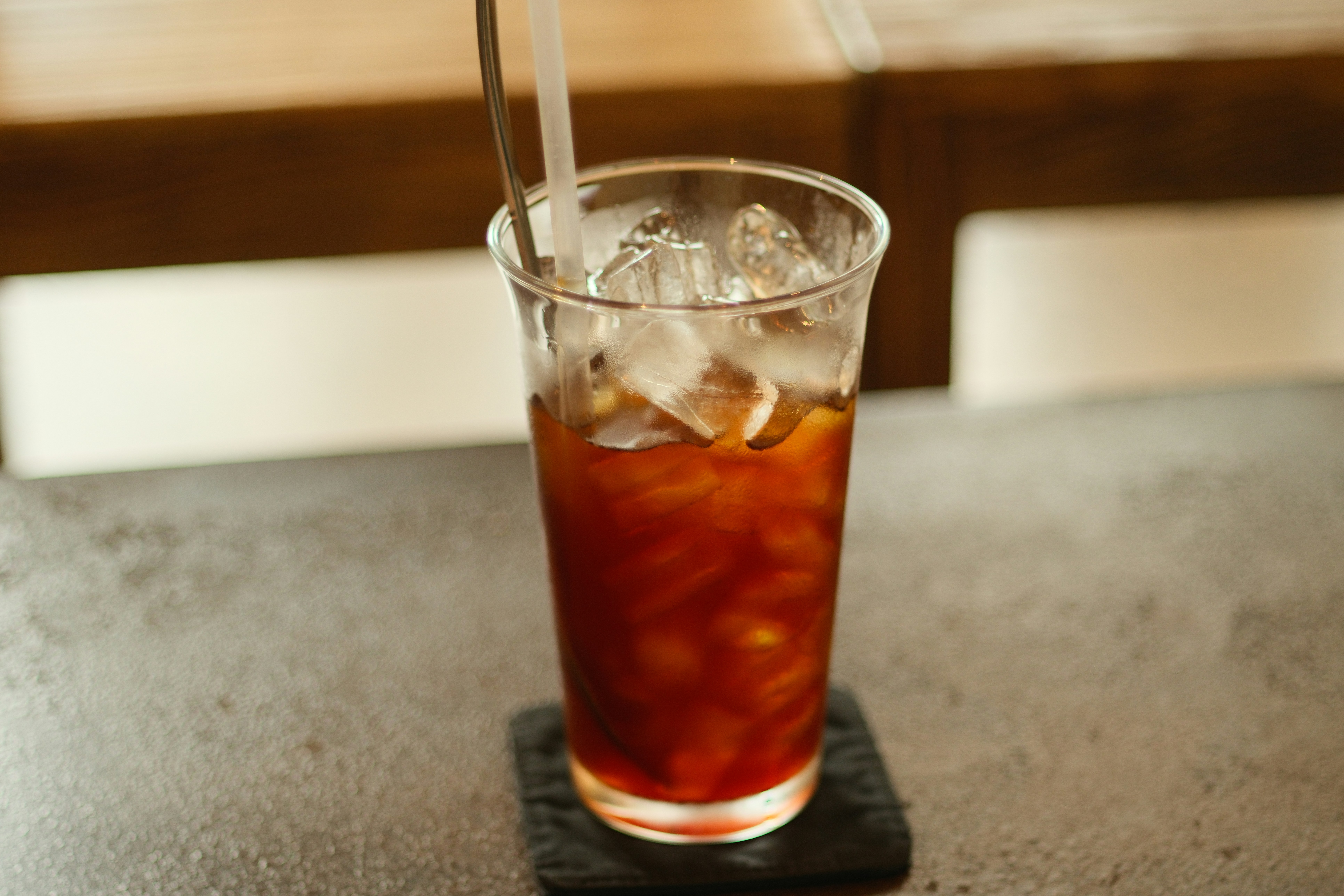 Iced Amber on Tile: A Glass of Cola at the Bar