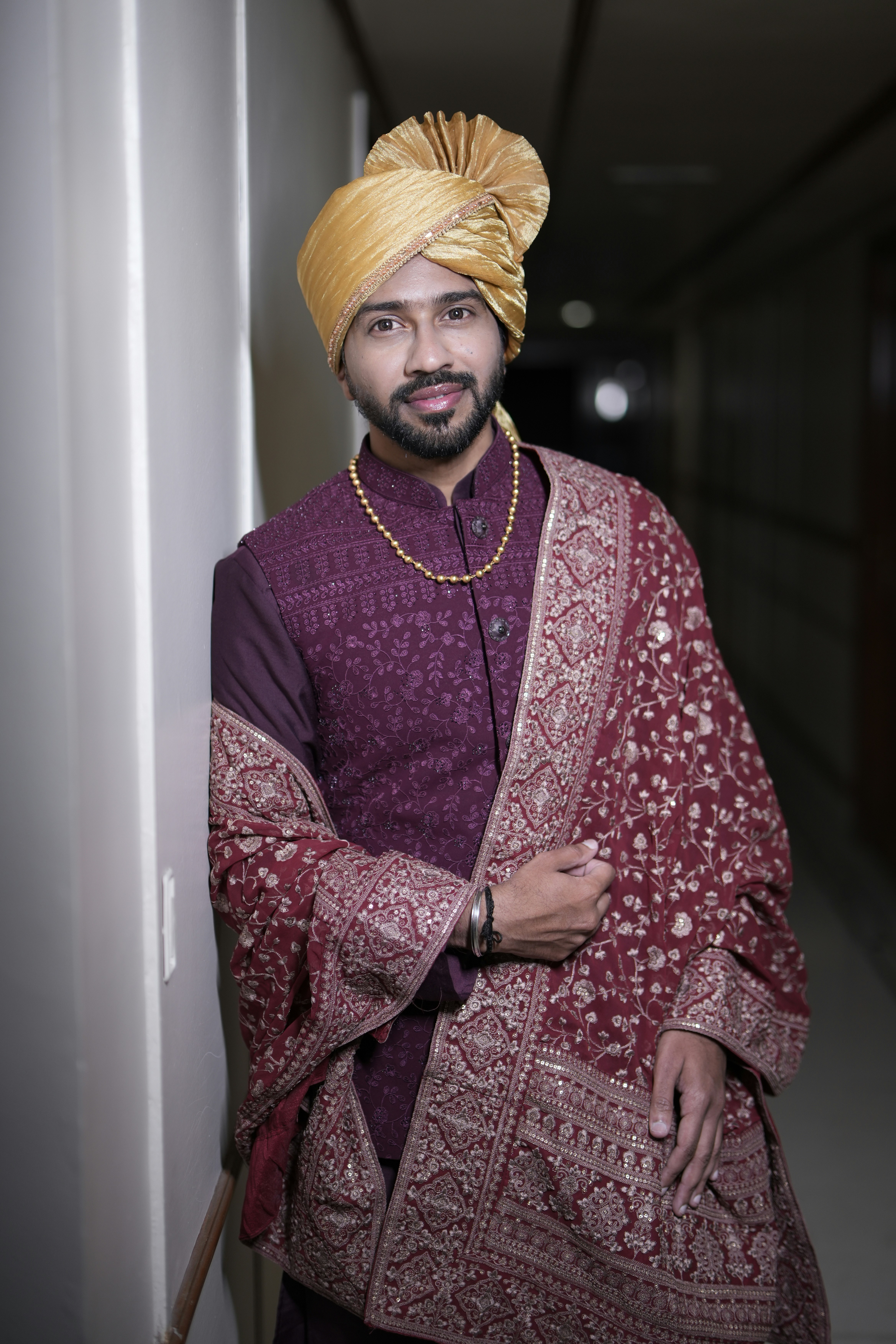 Portrait of a Groom: Turban, Beaded Necklace, and Regal Purple Attire