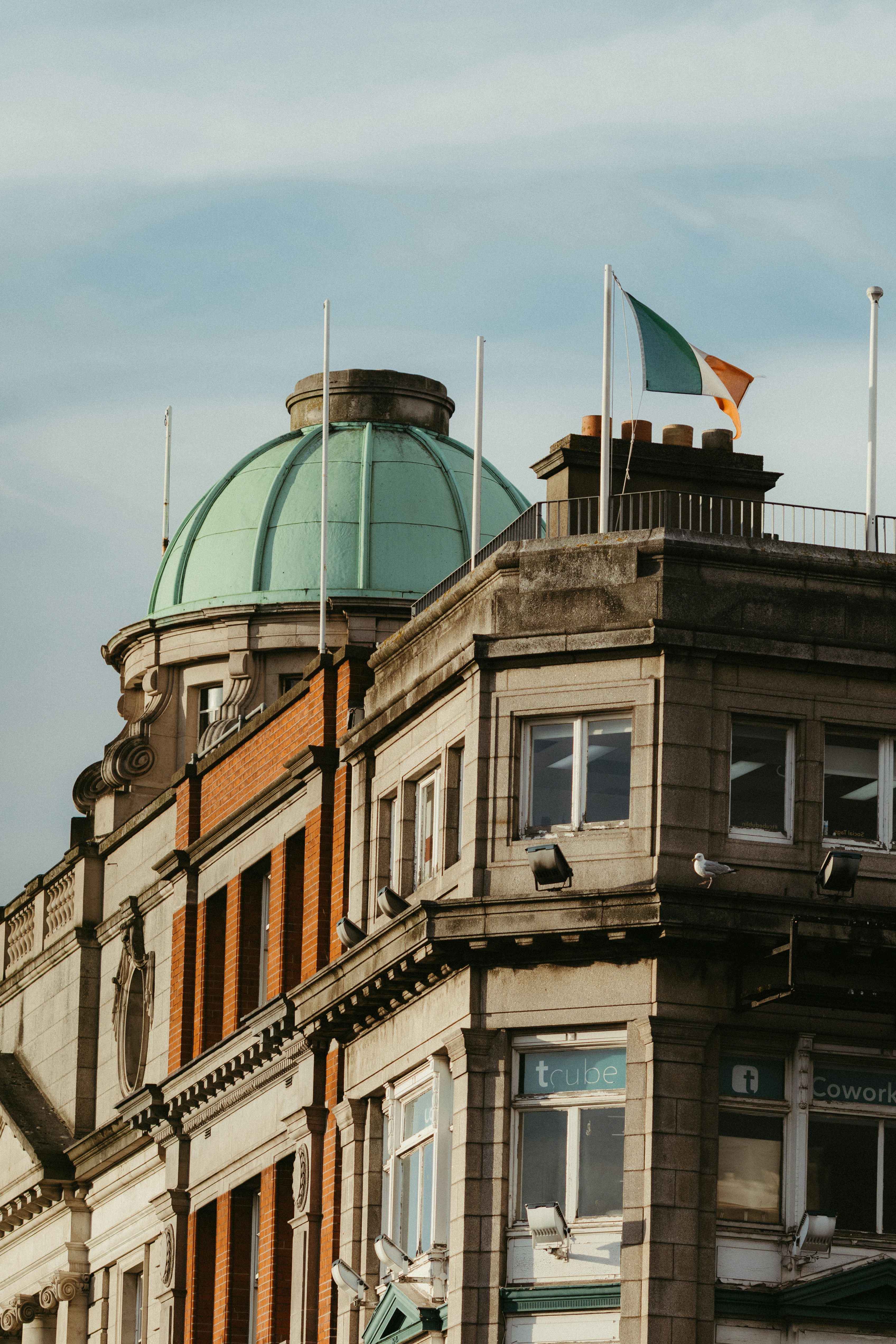 Dome and Flag over a Classic Urban Facade
